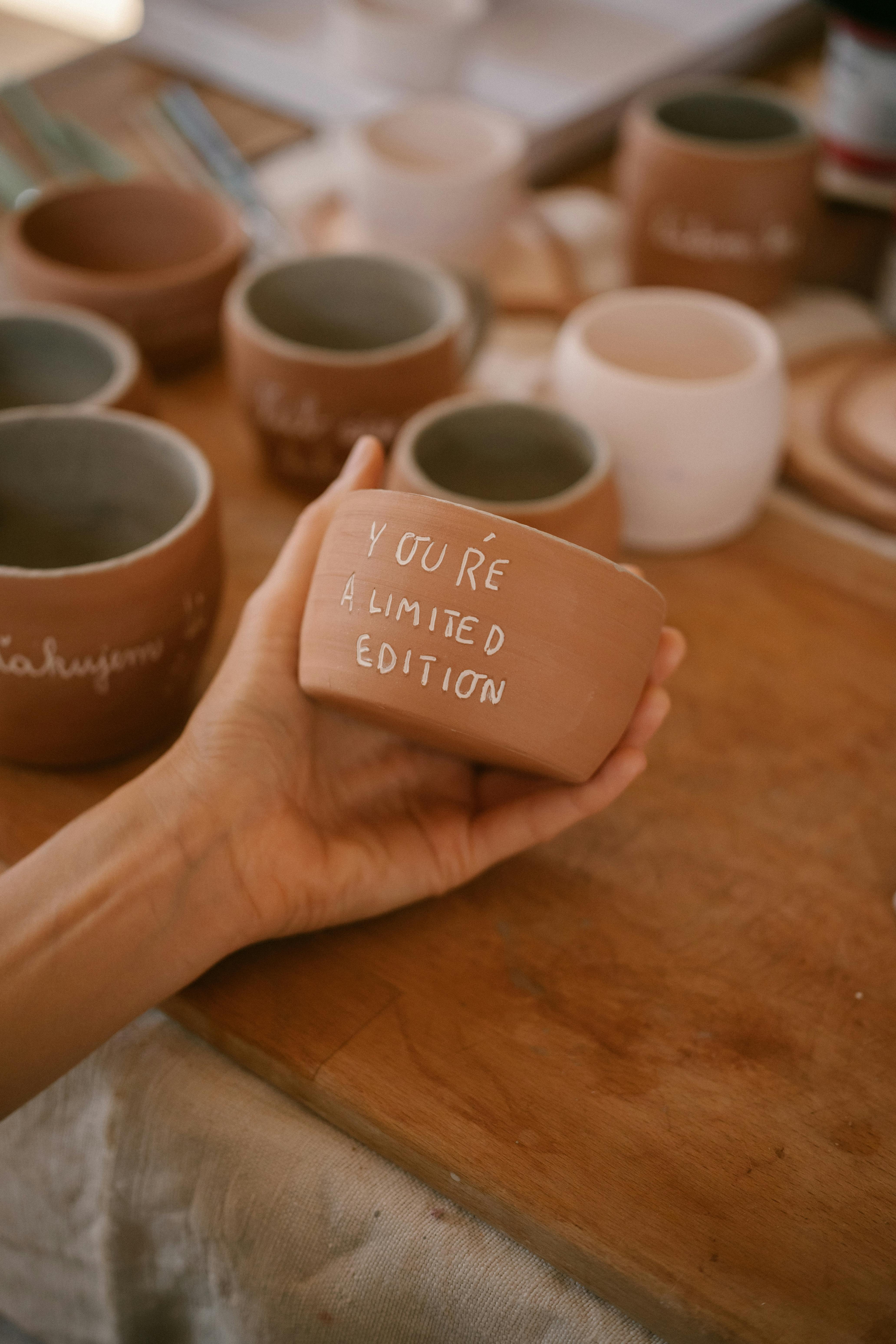 Handcrafted Ceramic Mug with Inspirational Text · Free Stock Photo