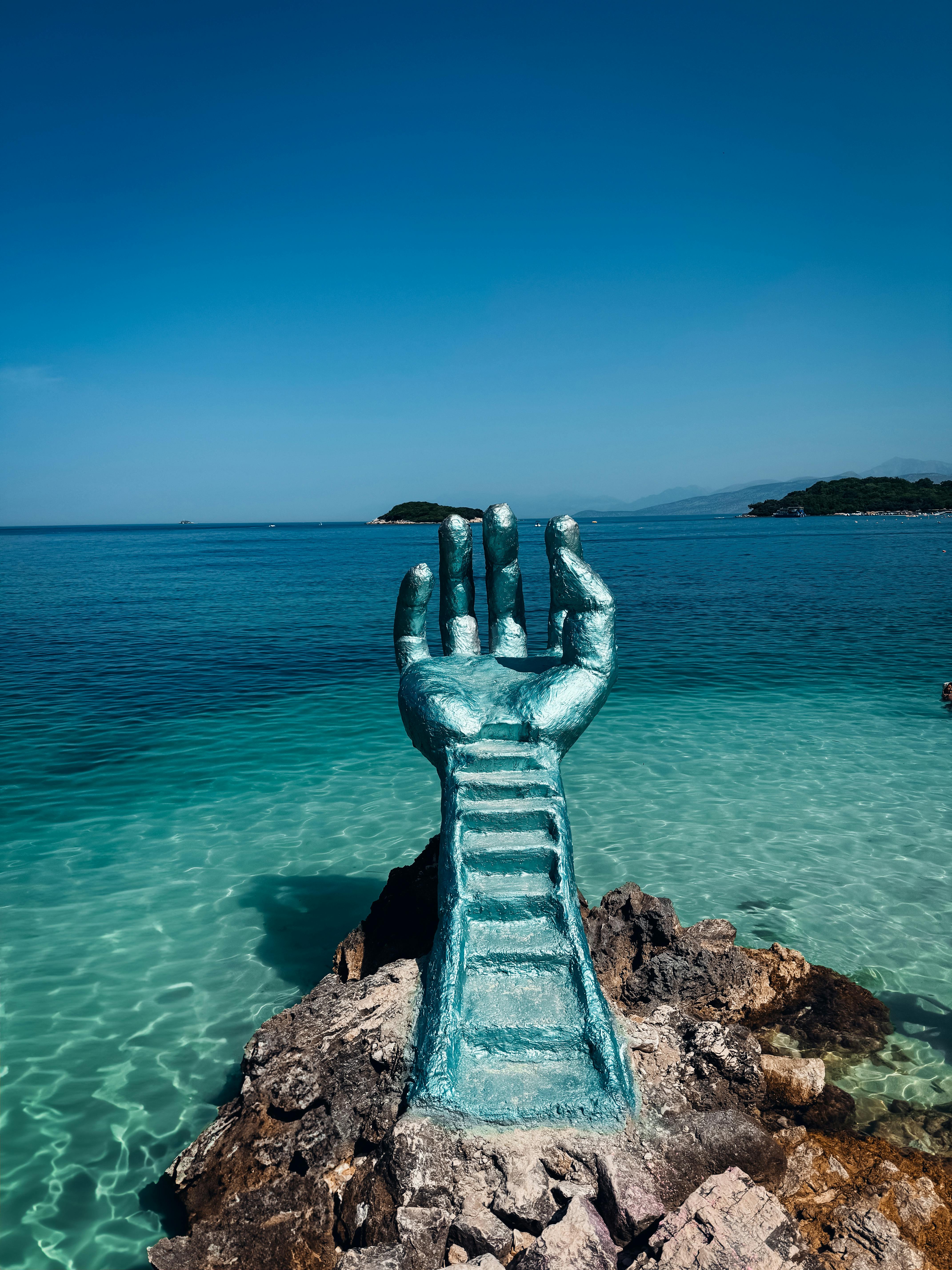 Sculpture of Hand Rising from Sea in Ksamil, Albania · Free Stock Photo