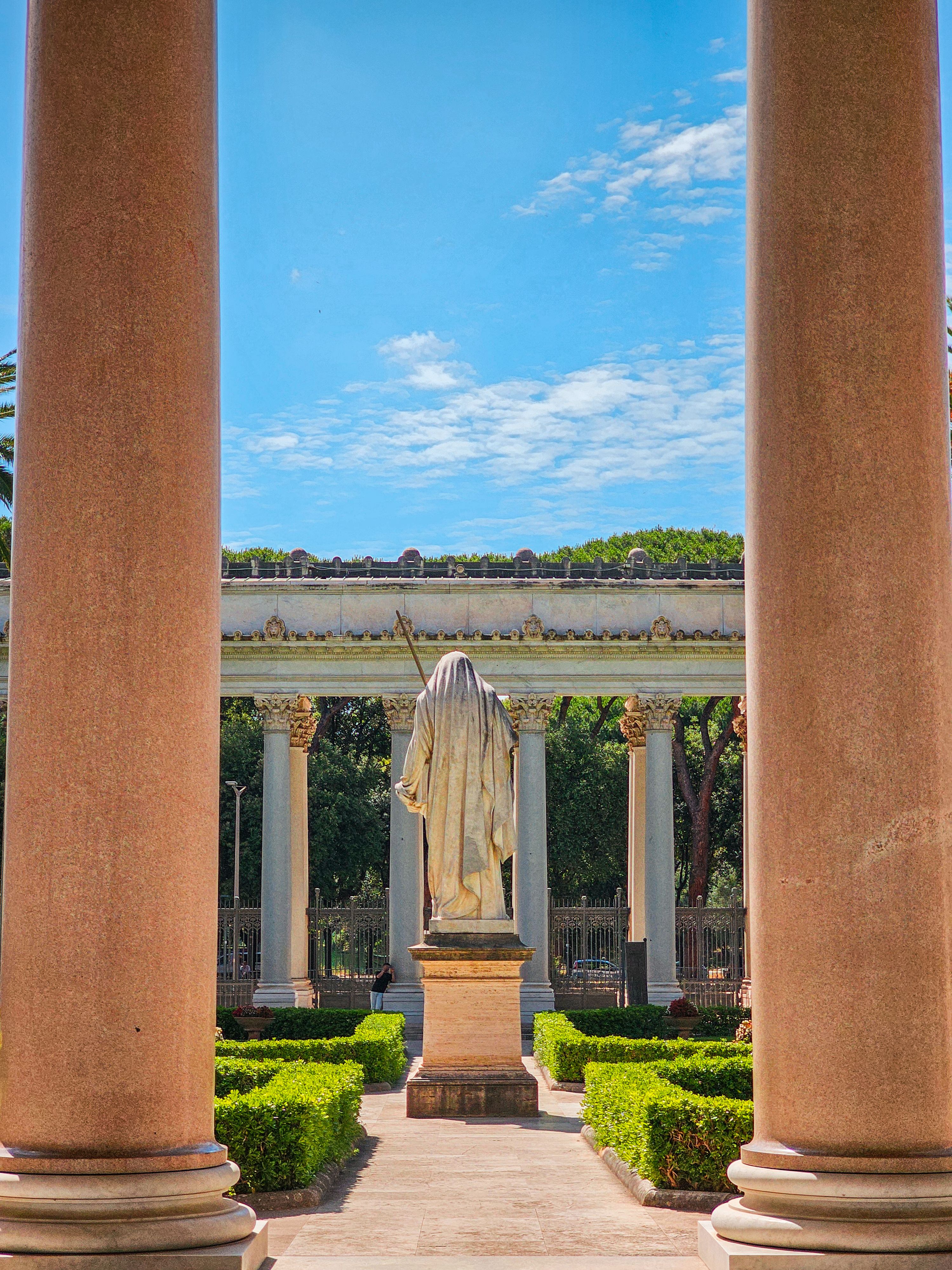 Ancient Statue Among Roman Columns in Rome · Free Stock Photo