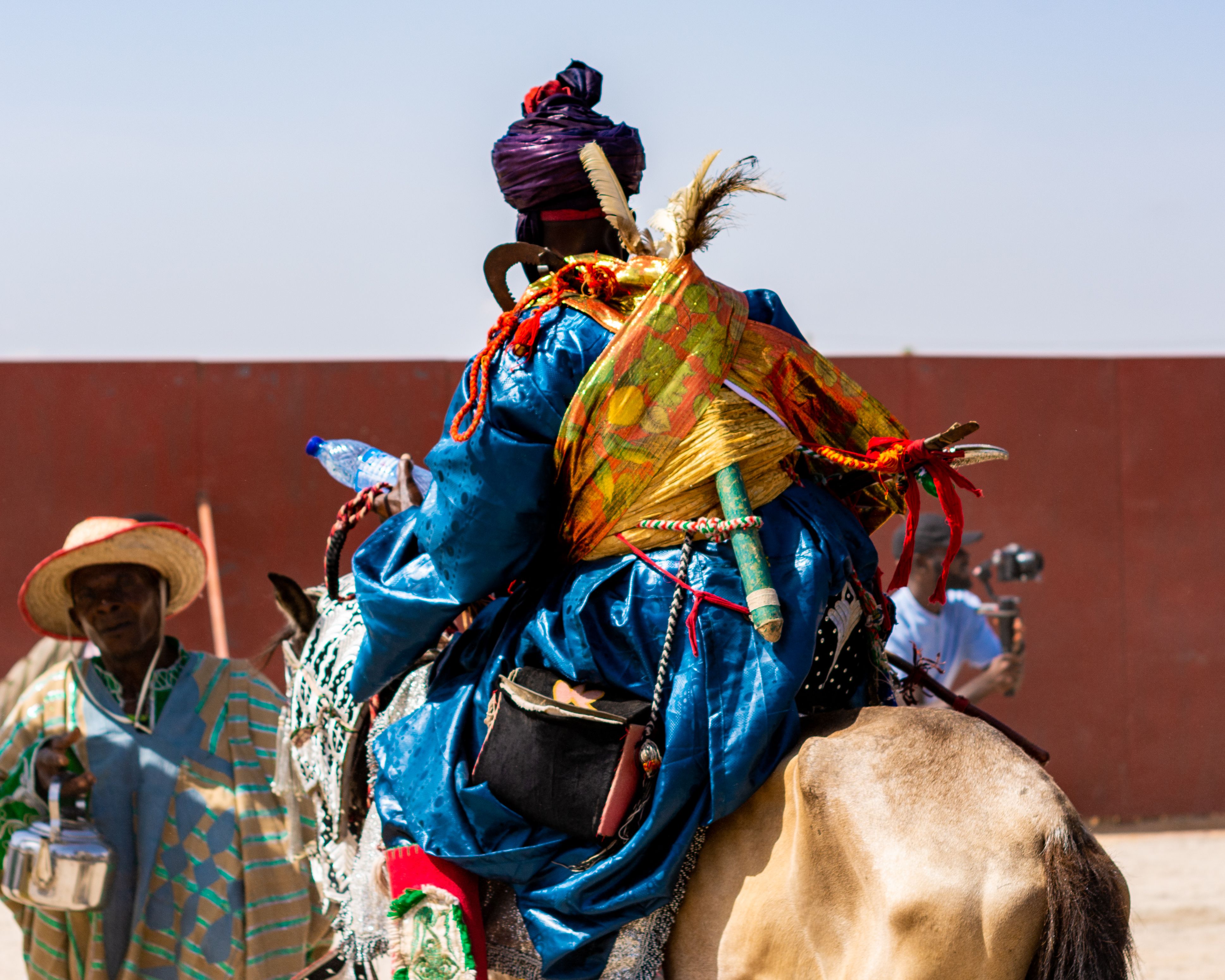 Colorful Traditional Attire in Desert Setting · Free Stock Photo