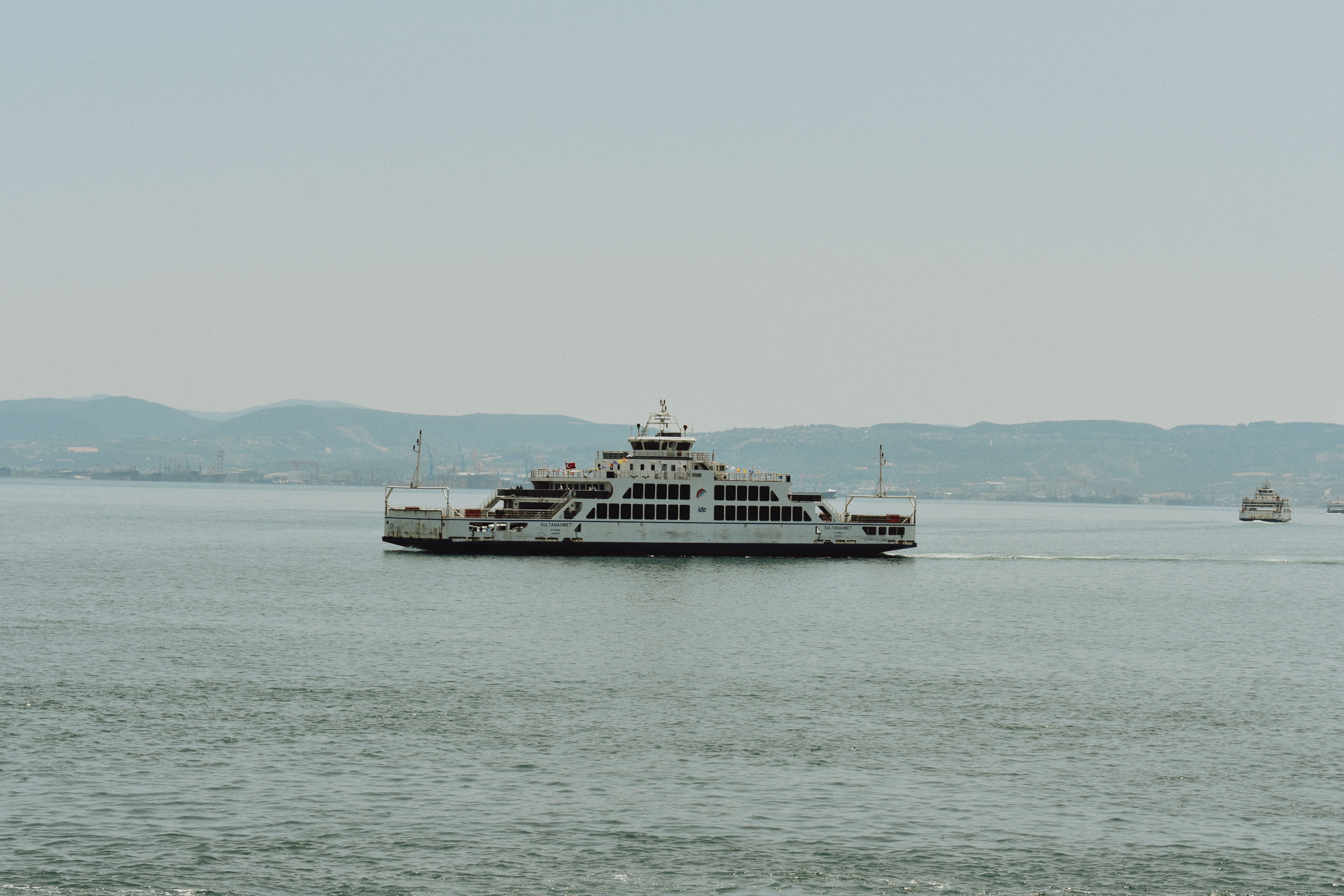 Ferry Crossing Calm Waters on Sunny Day · Free Stock Photo