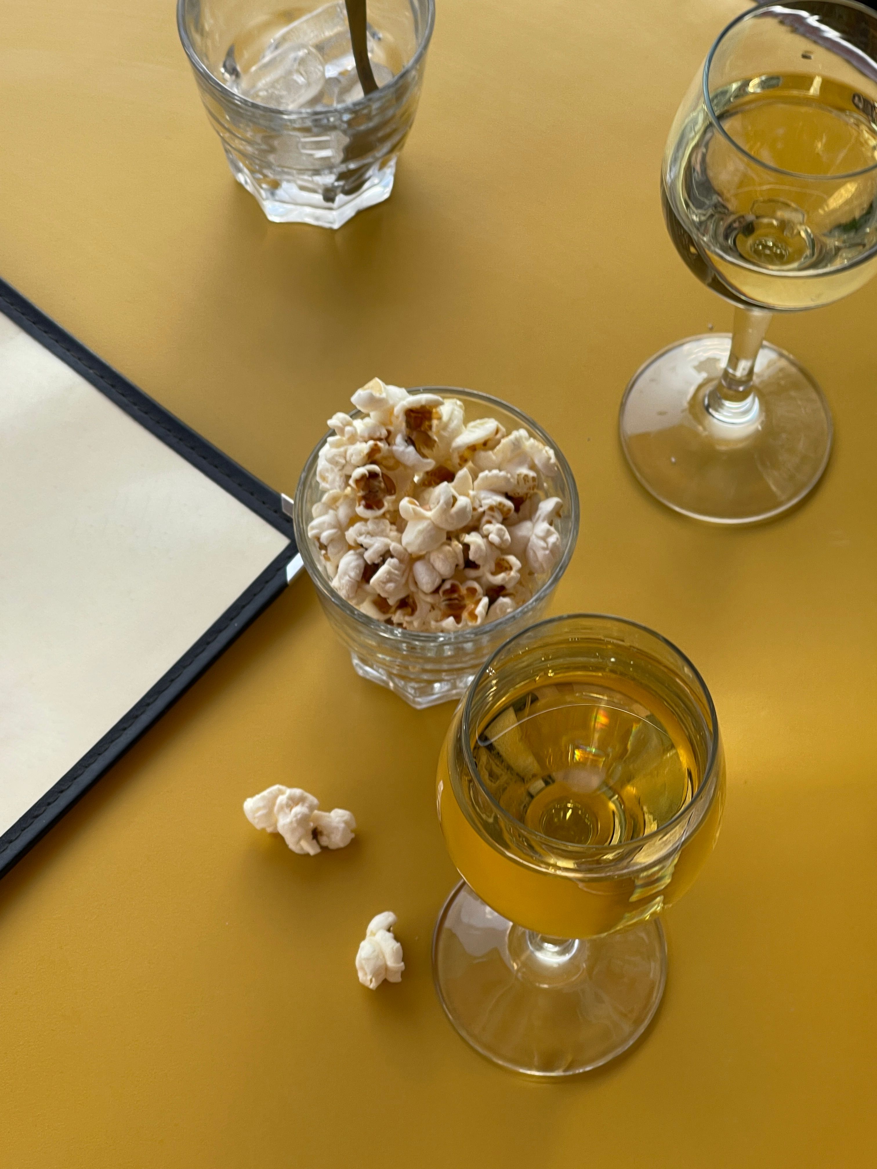 Popcorn and Drinks on a Yellow Table · Free Stock Photo