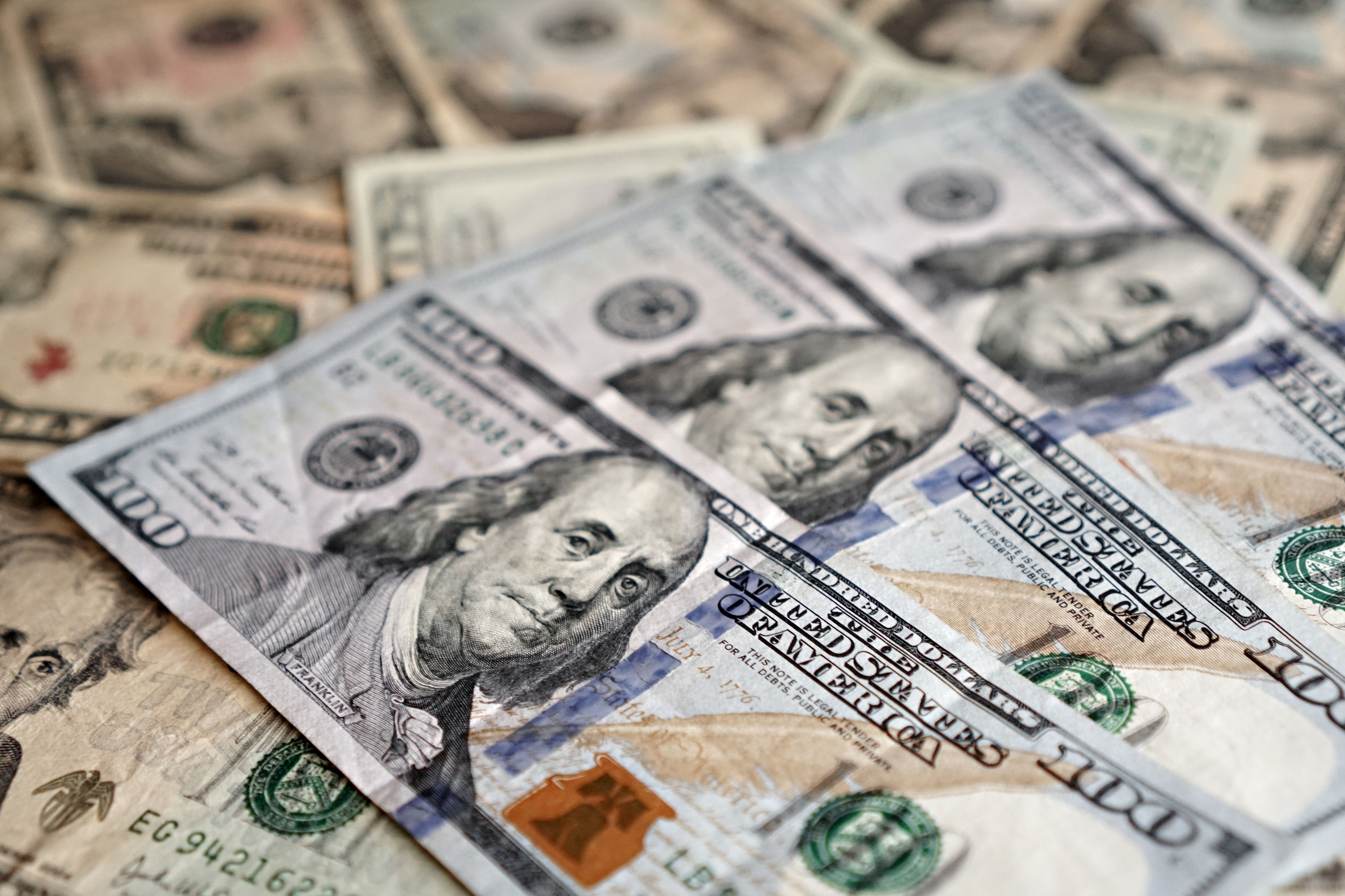 Heap of different nominal per dollars · Free Stock Photo