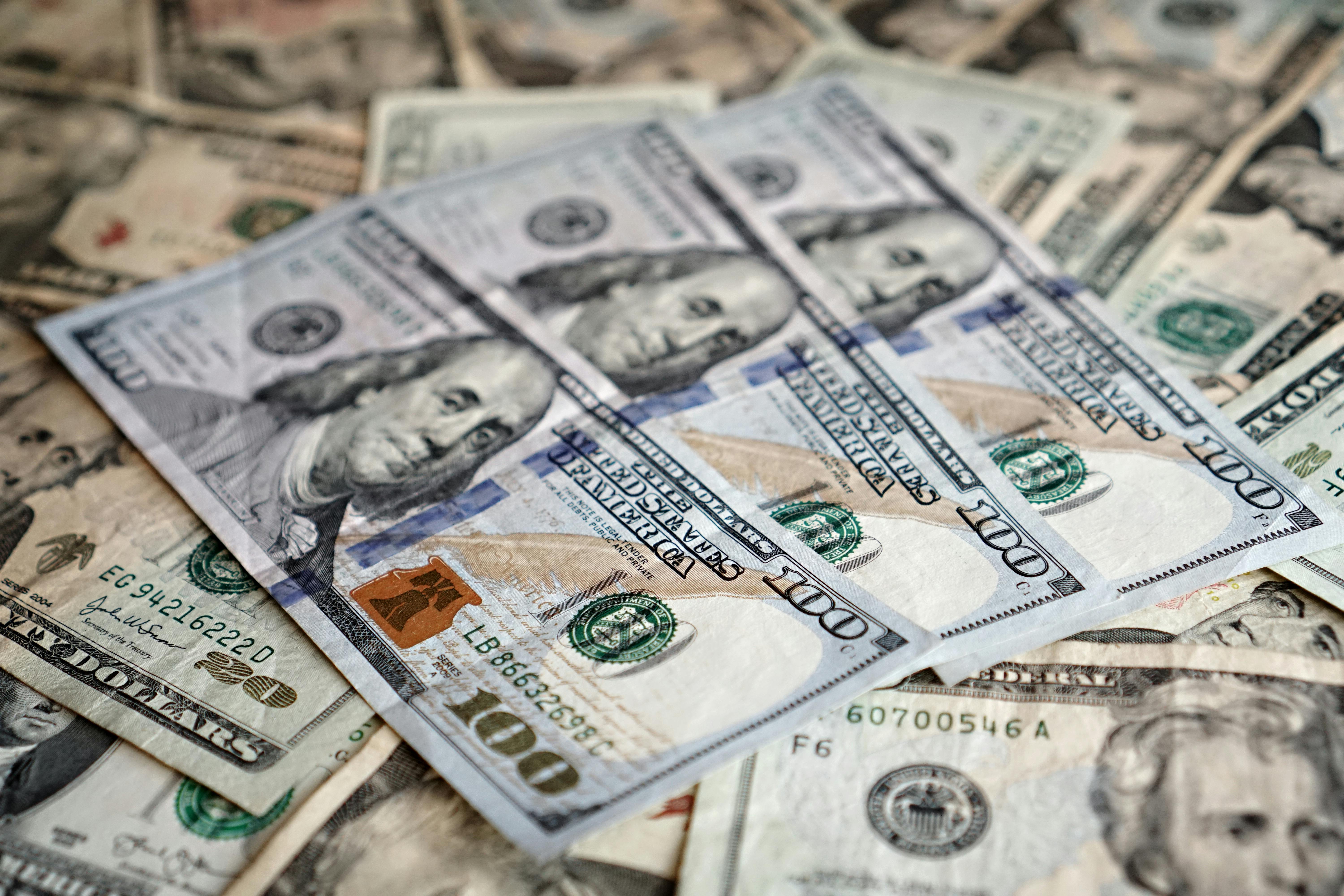 Close-up of Stacked US Dollar Banknotes · Free Stock Photo