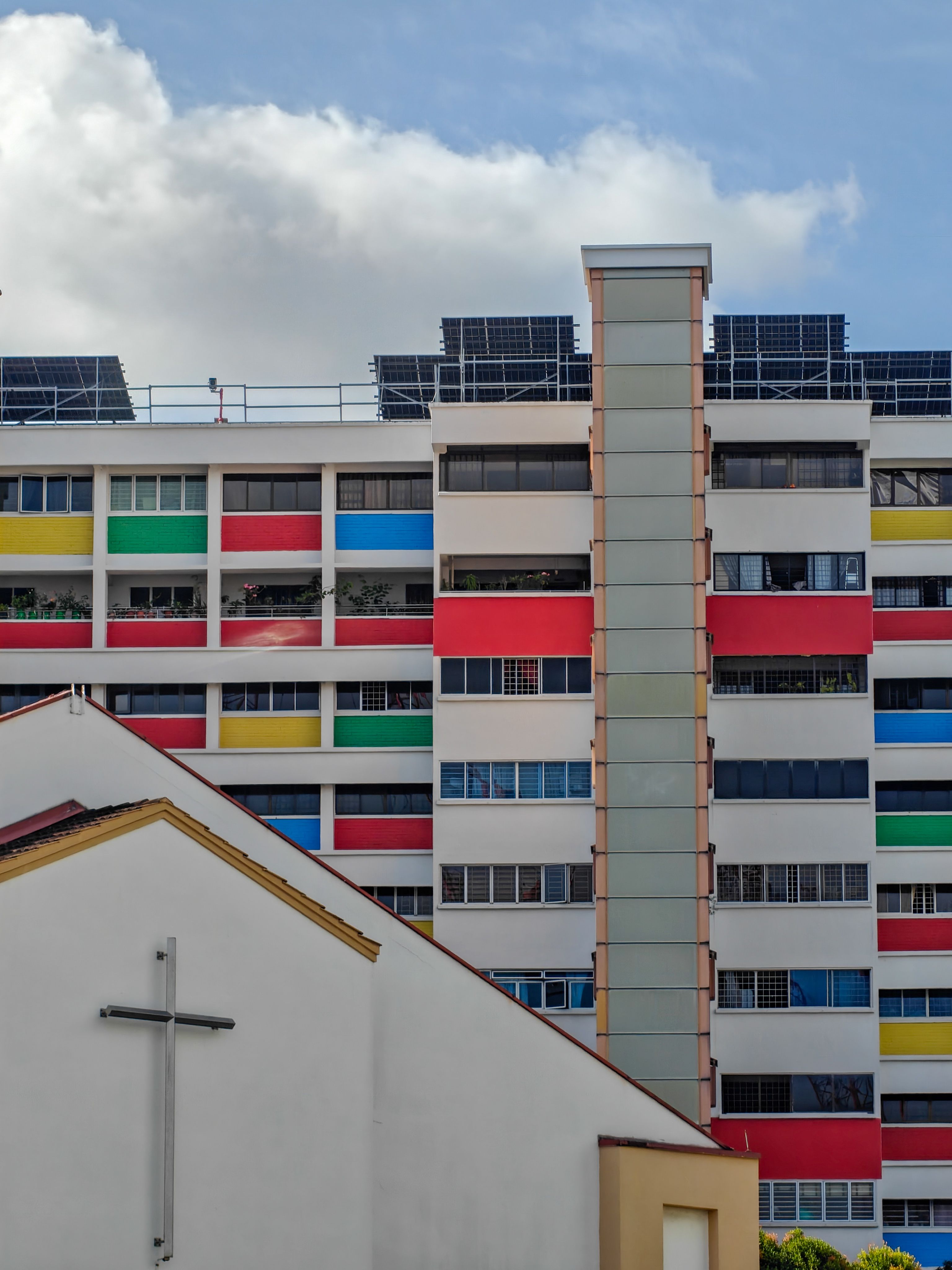 Colorful Urban Building with Church Cross · Free Stock Photo