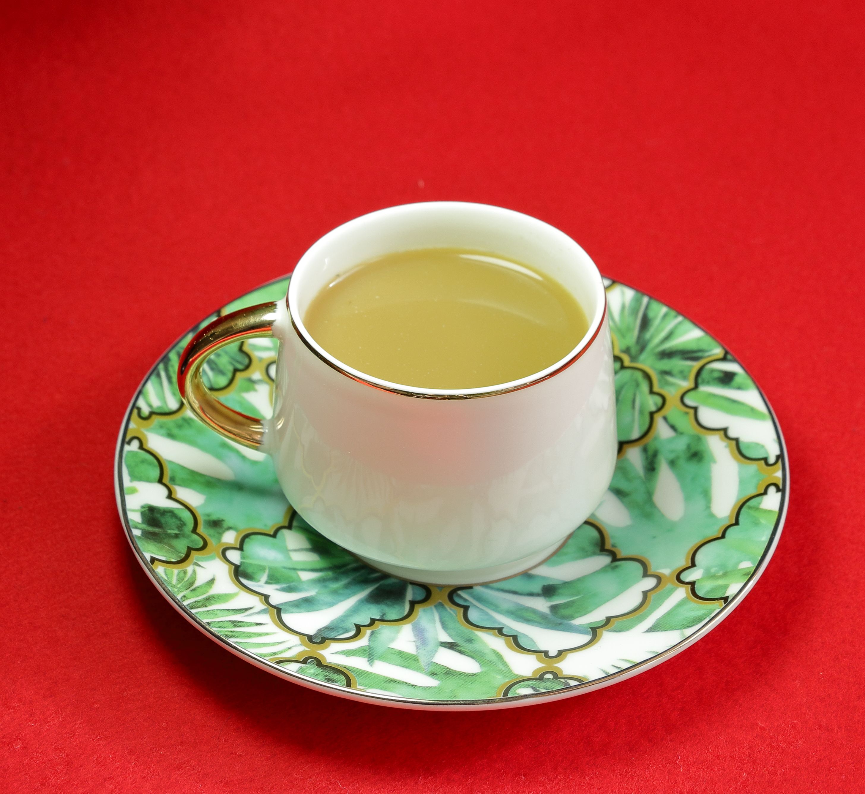 Elegant Tea Cup on Bold Red Background · Free Stock Photo
