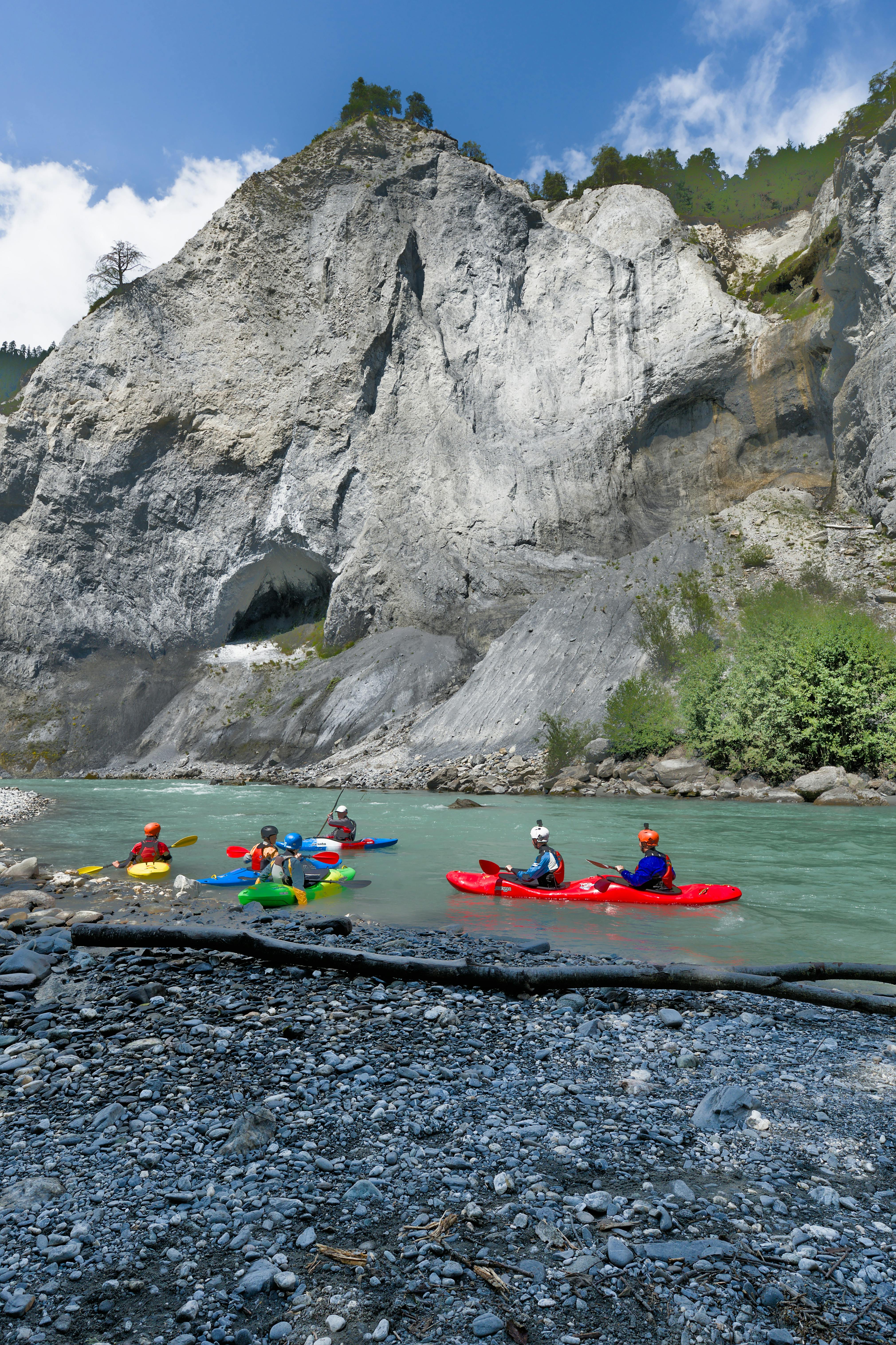 Kayakers Navigating Swiss Rapids in Scenic Gorge · Free Stock Photo