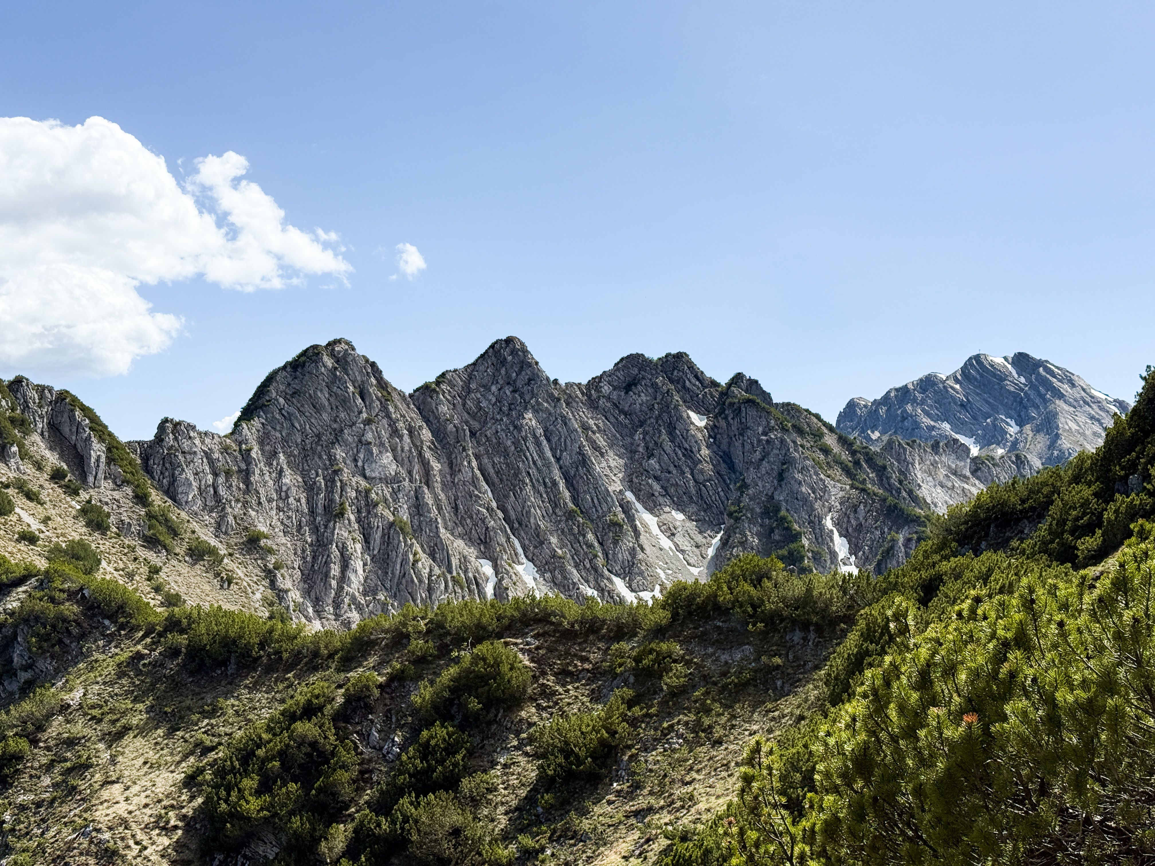 Jagged Mountain Peaks Under Clear Blue Sky · Free Stock Photo