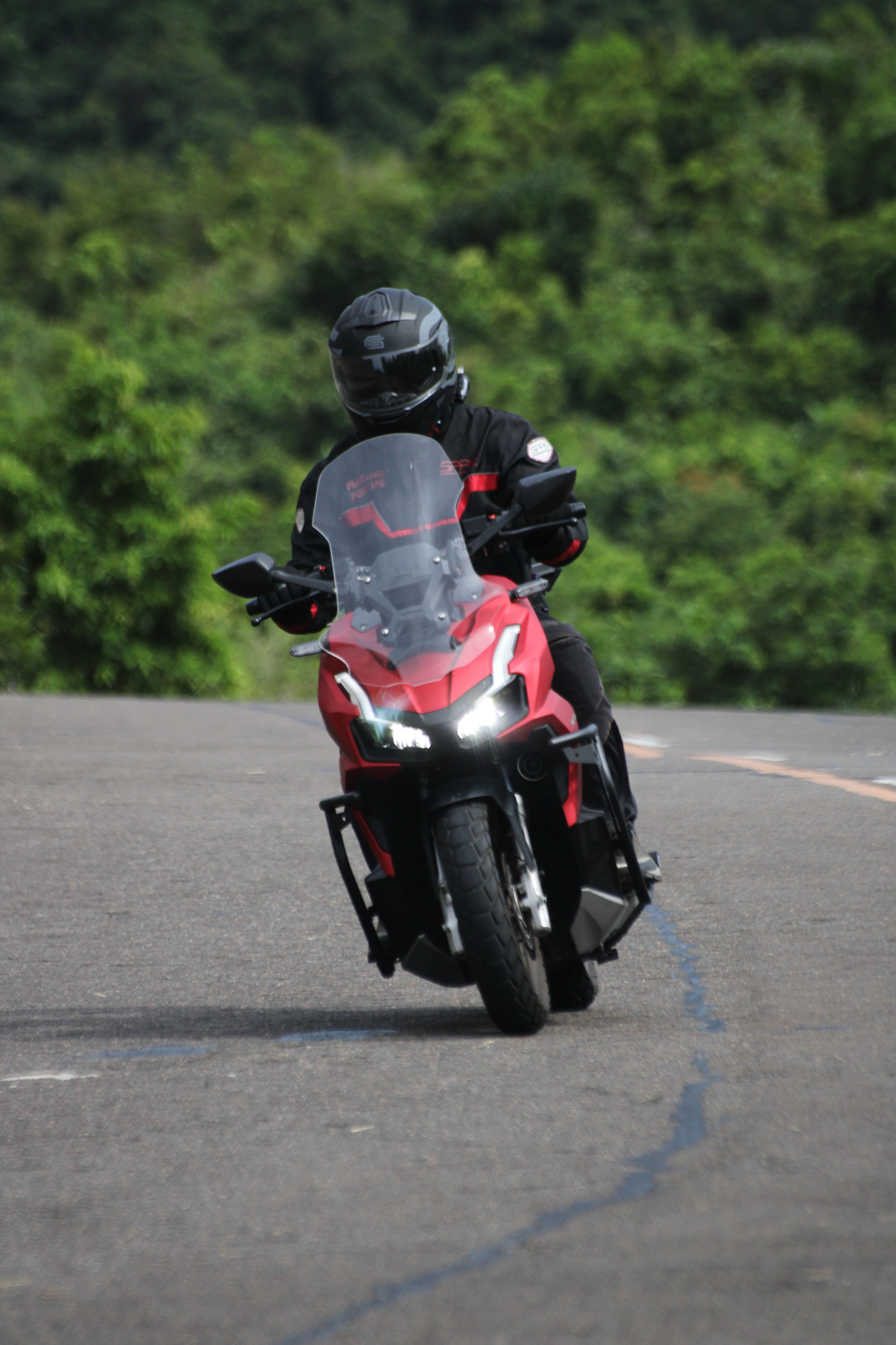 Motorcyclist on Red bike on a Scenic Road · Free Stock Photo