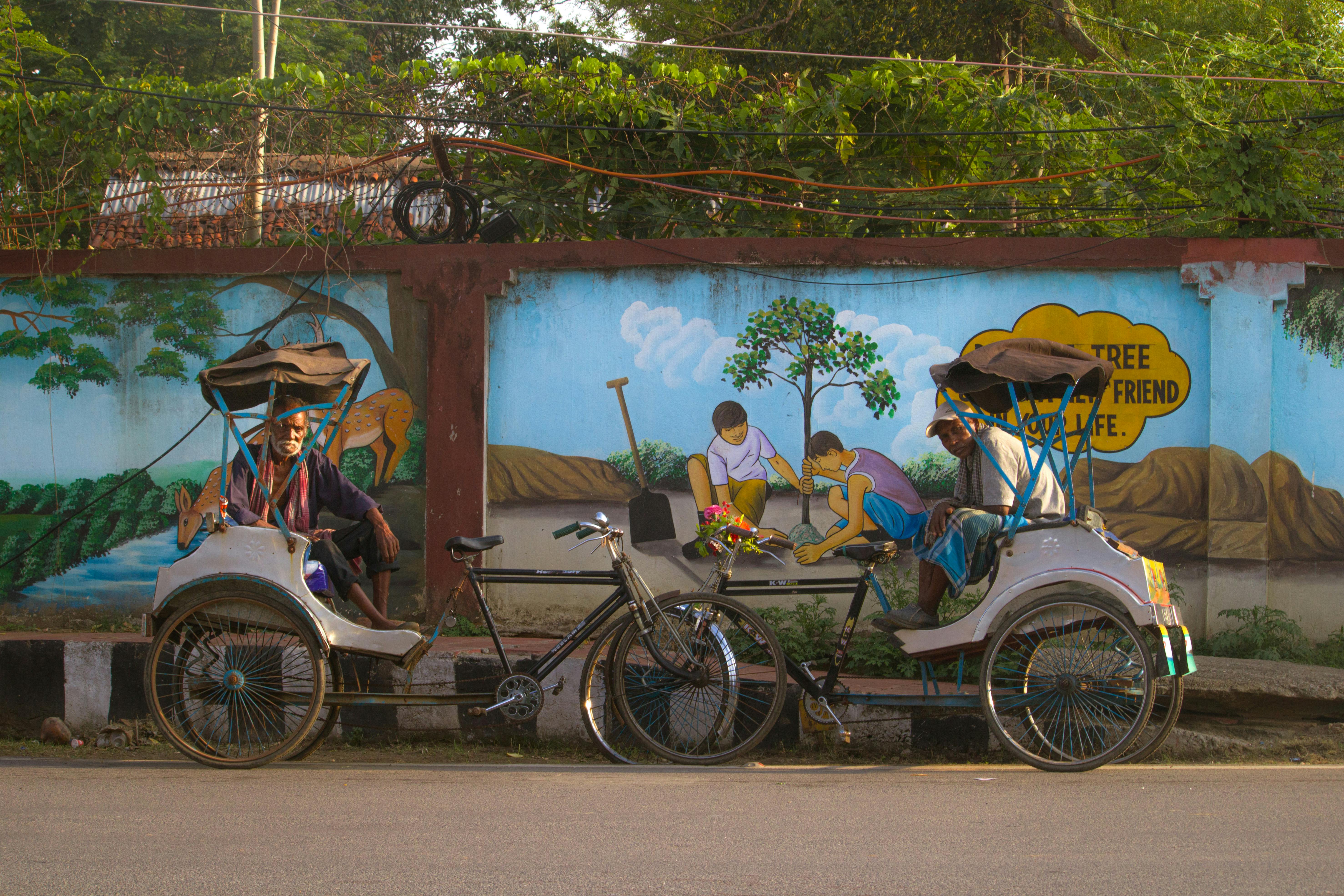 Colorful Rickshaw Scene with Street Art Mural · Free Stock Photo
