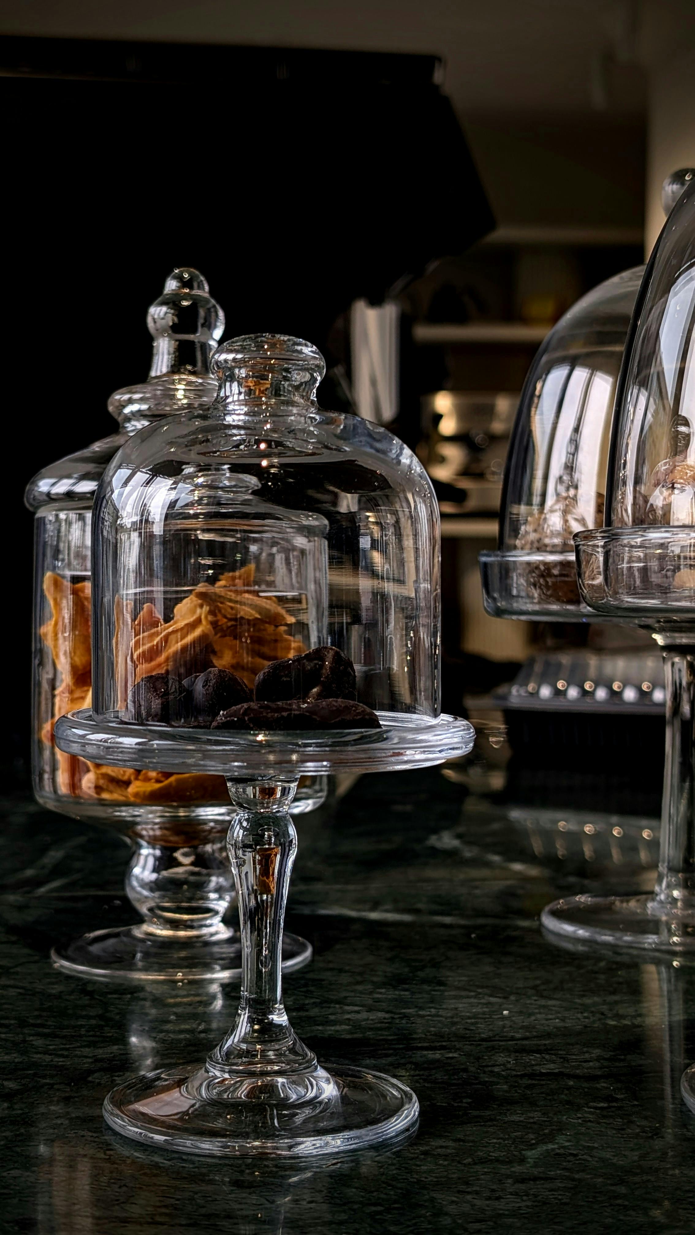 Elegant Display of Glass Dessert Stands · Free Stock Photo