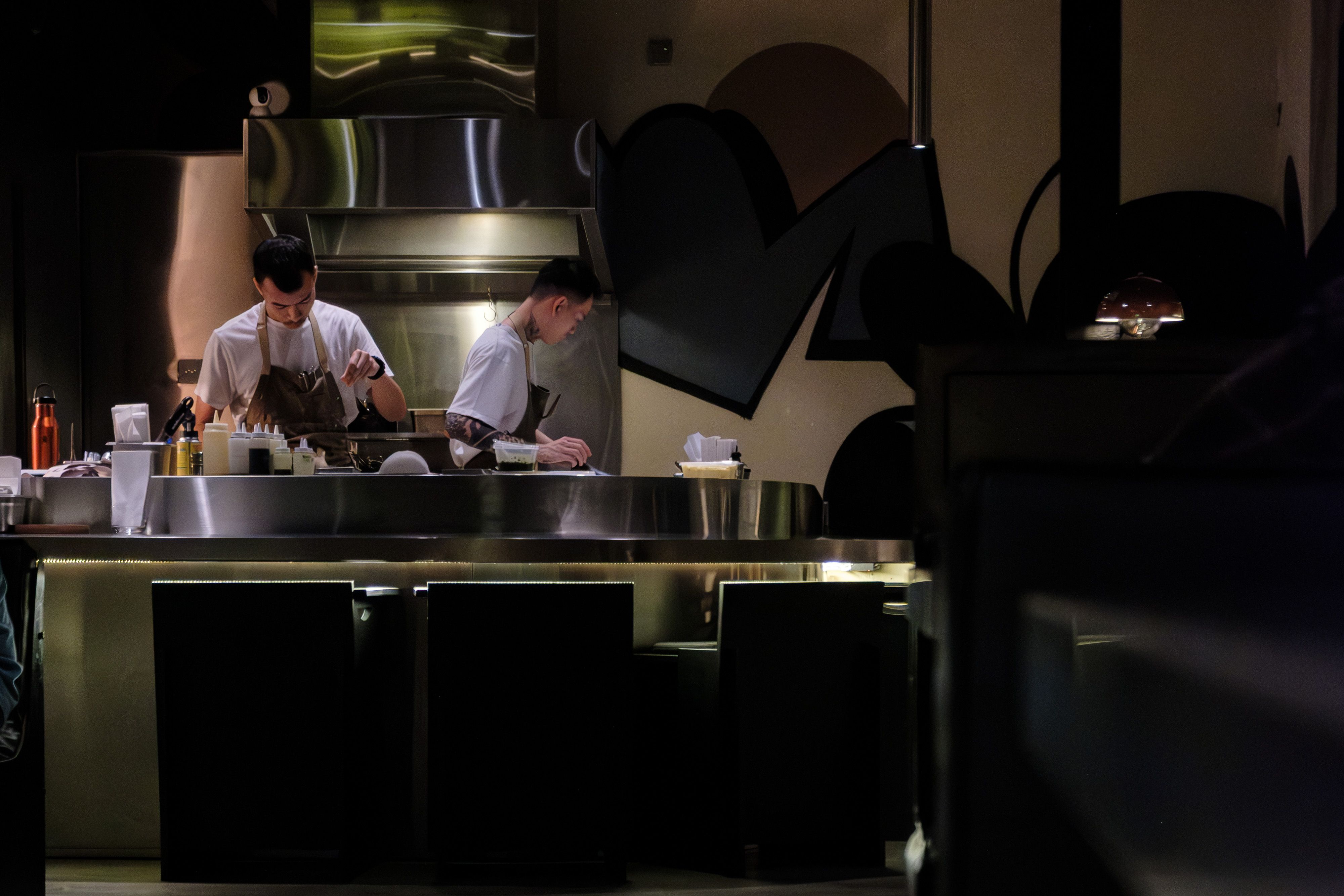 Chefs Cooking in Modern Restaurant Kitchen · Free Stock Photo