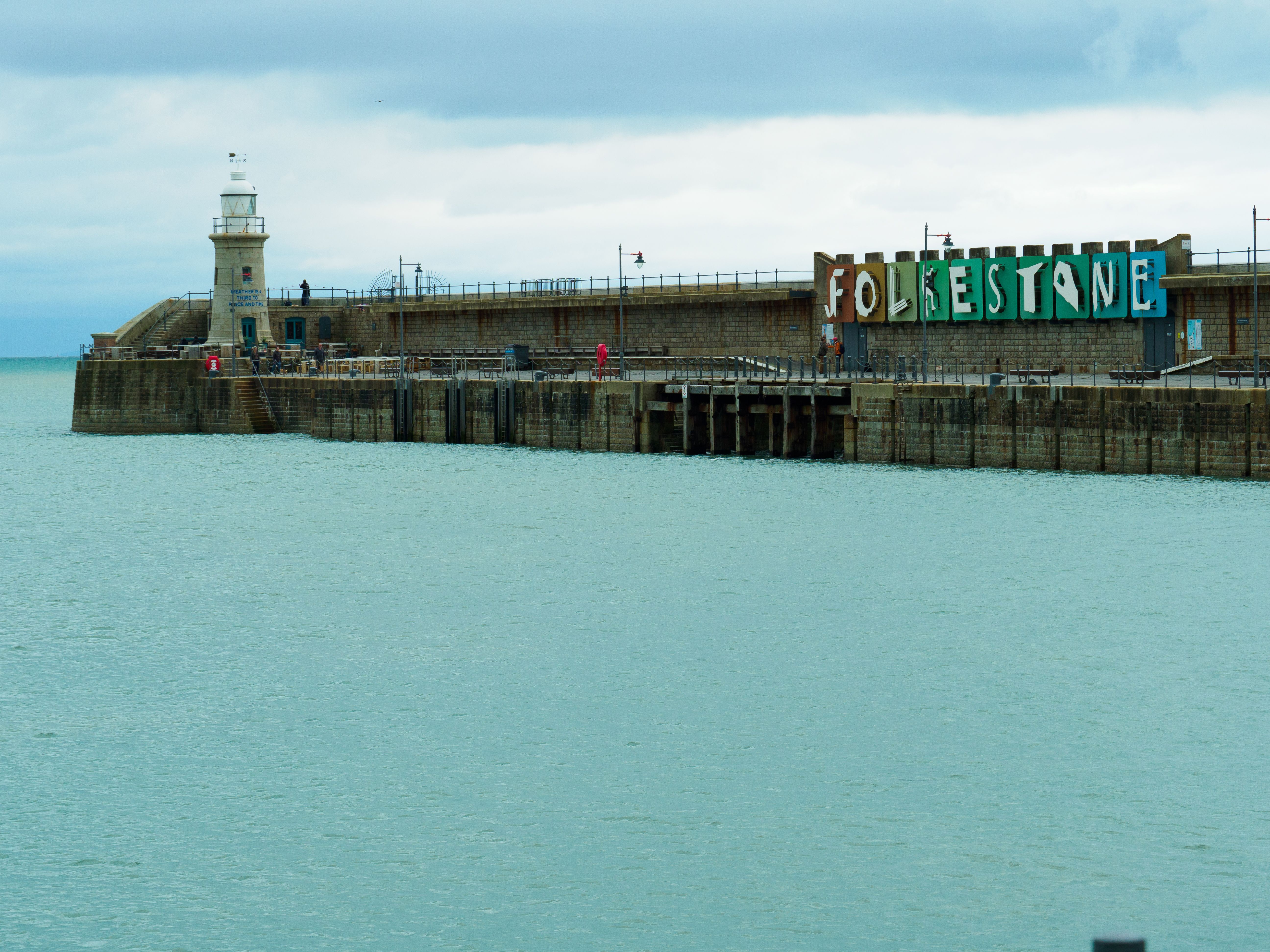 Folkestone Harbor with Lighthouse and Calm Waters · Free Stock Photo