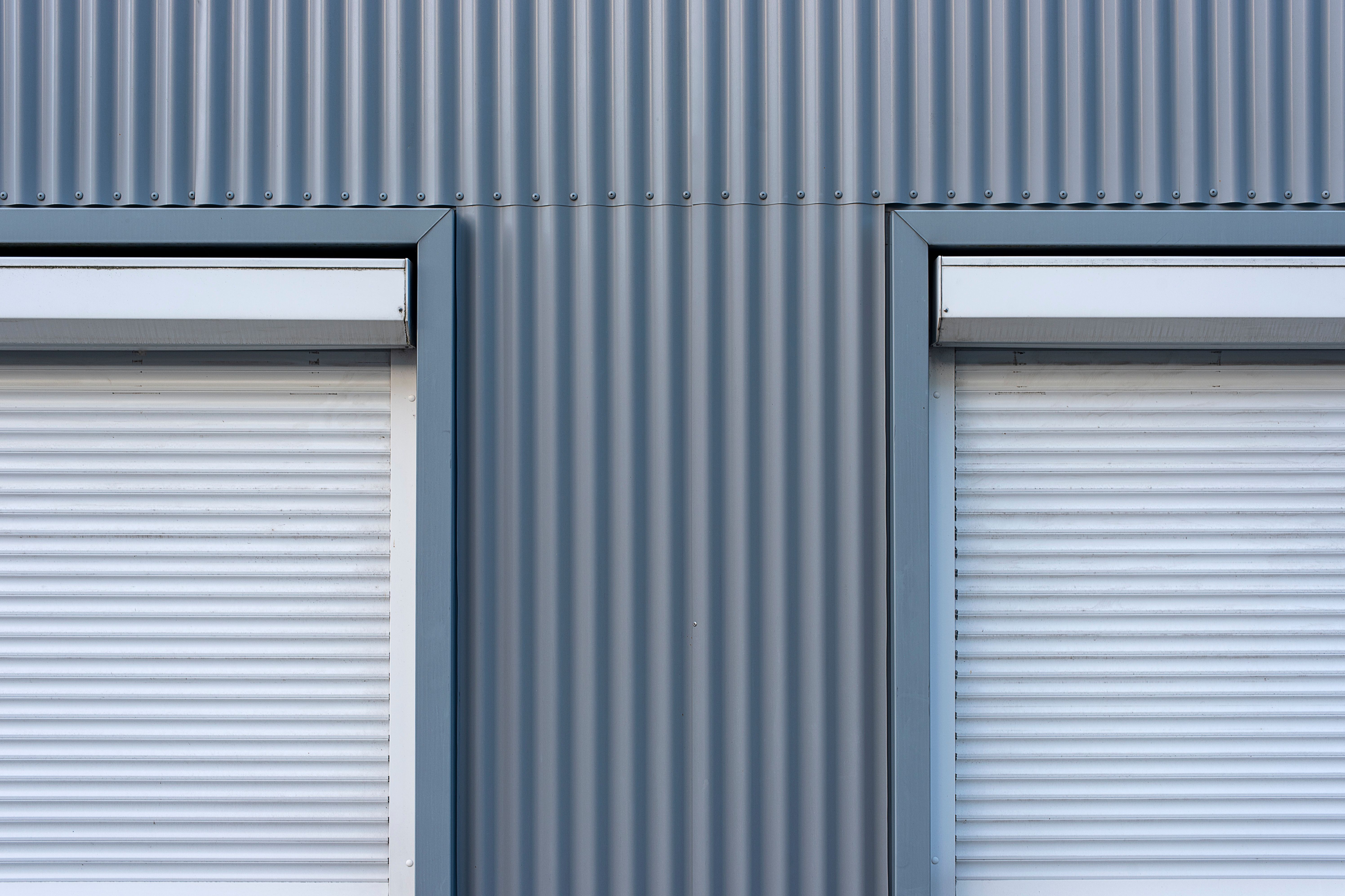 Industrial Modern Roller Blinds on Metal Wall · Free Stock Photo