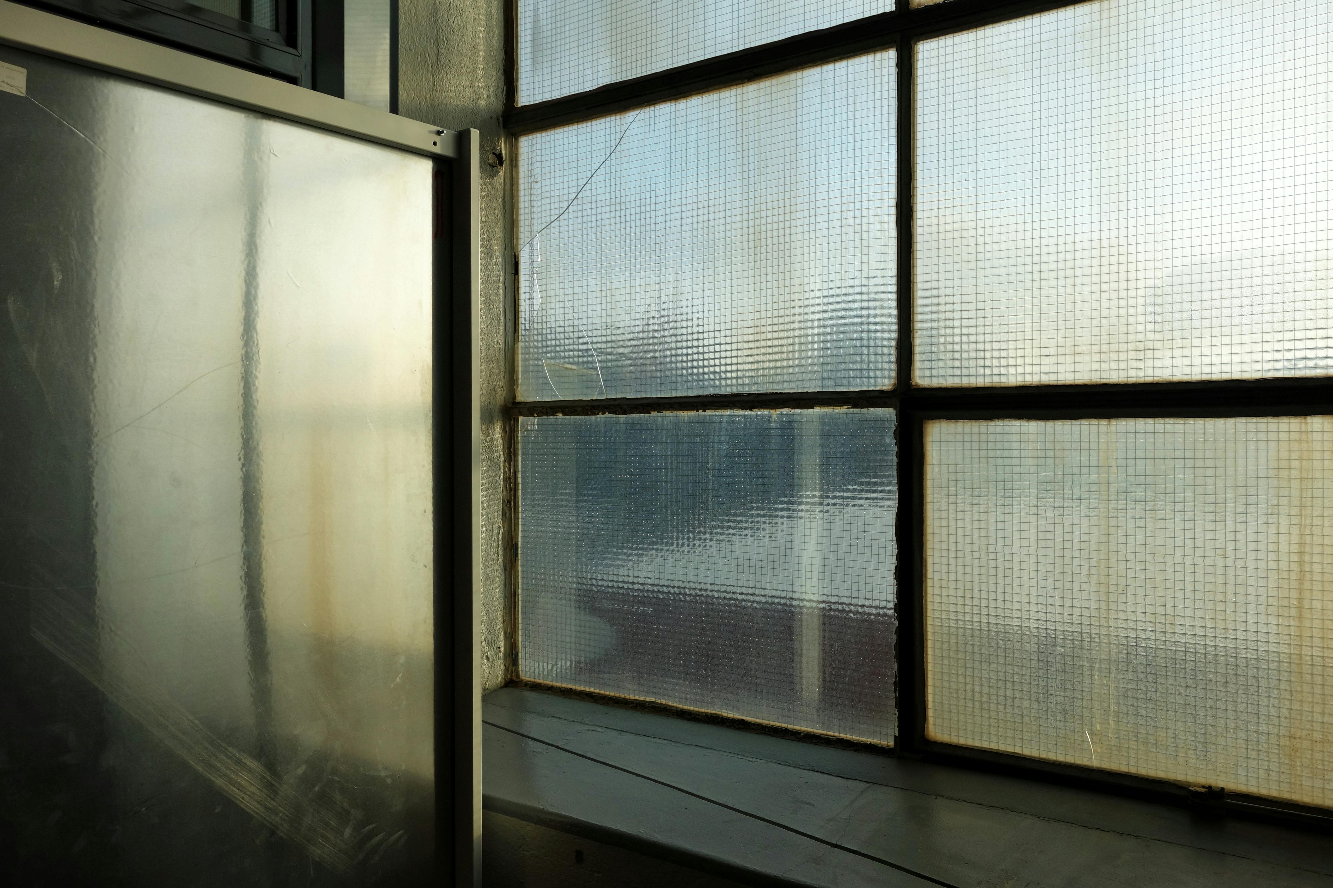 Textured Wire Glass Window in Industrial Setting · Free Stock Photo