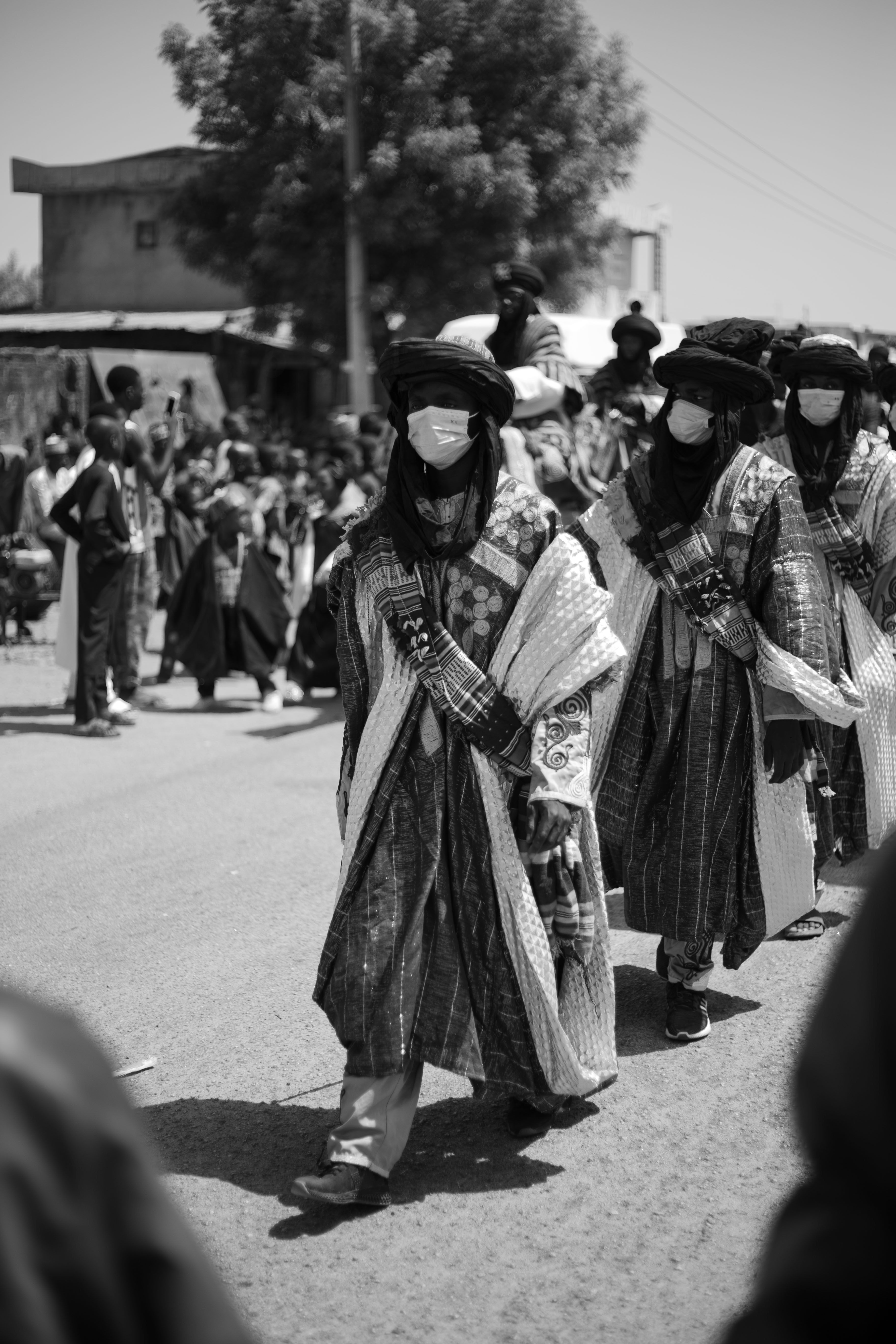 Traditional Parade with Masked Attendees in Africa · Free Stock Photo