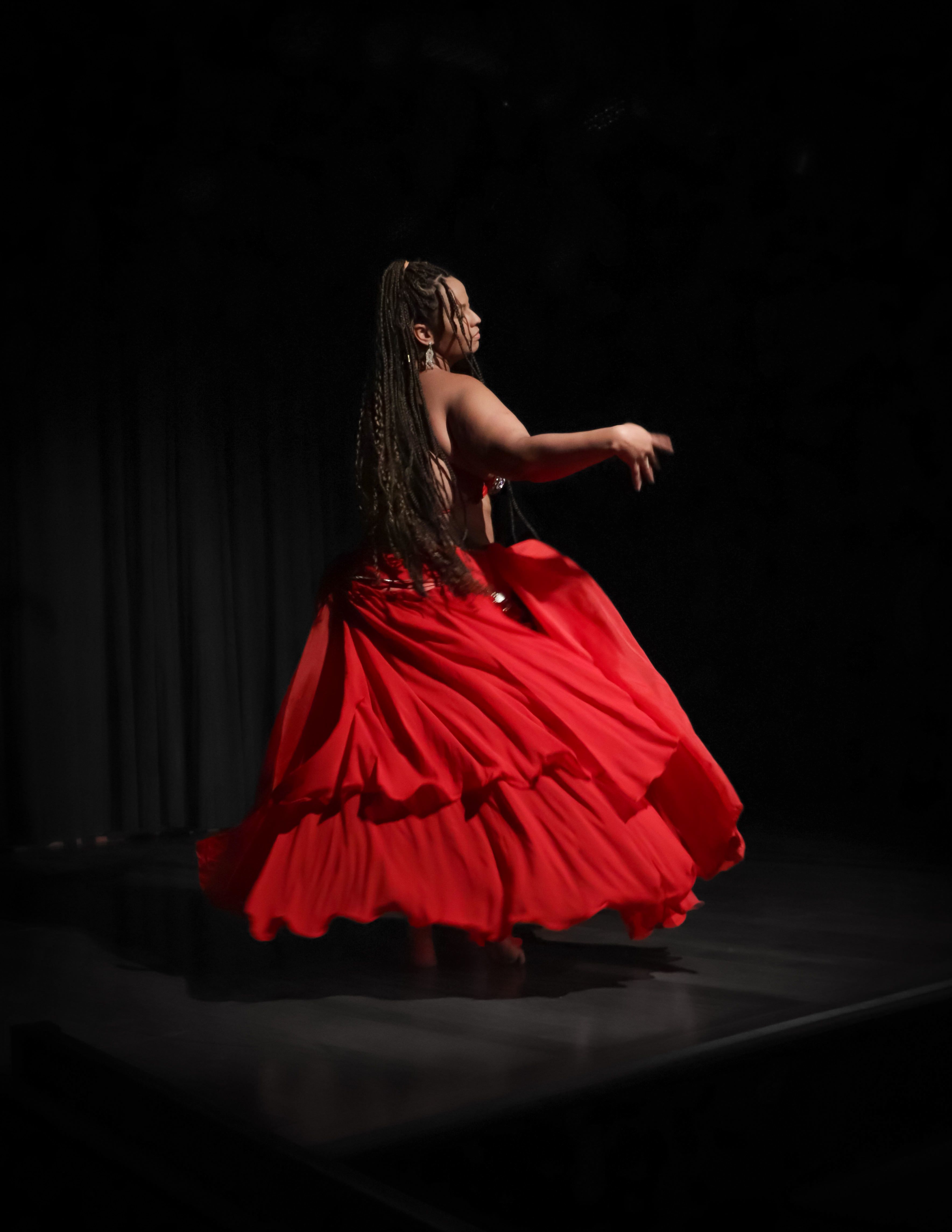 Elegant Dance Performance in Flowing Red Dress · Free Stock Photo