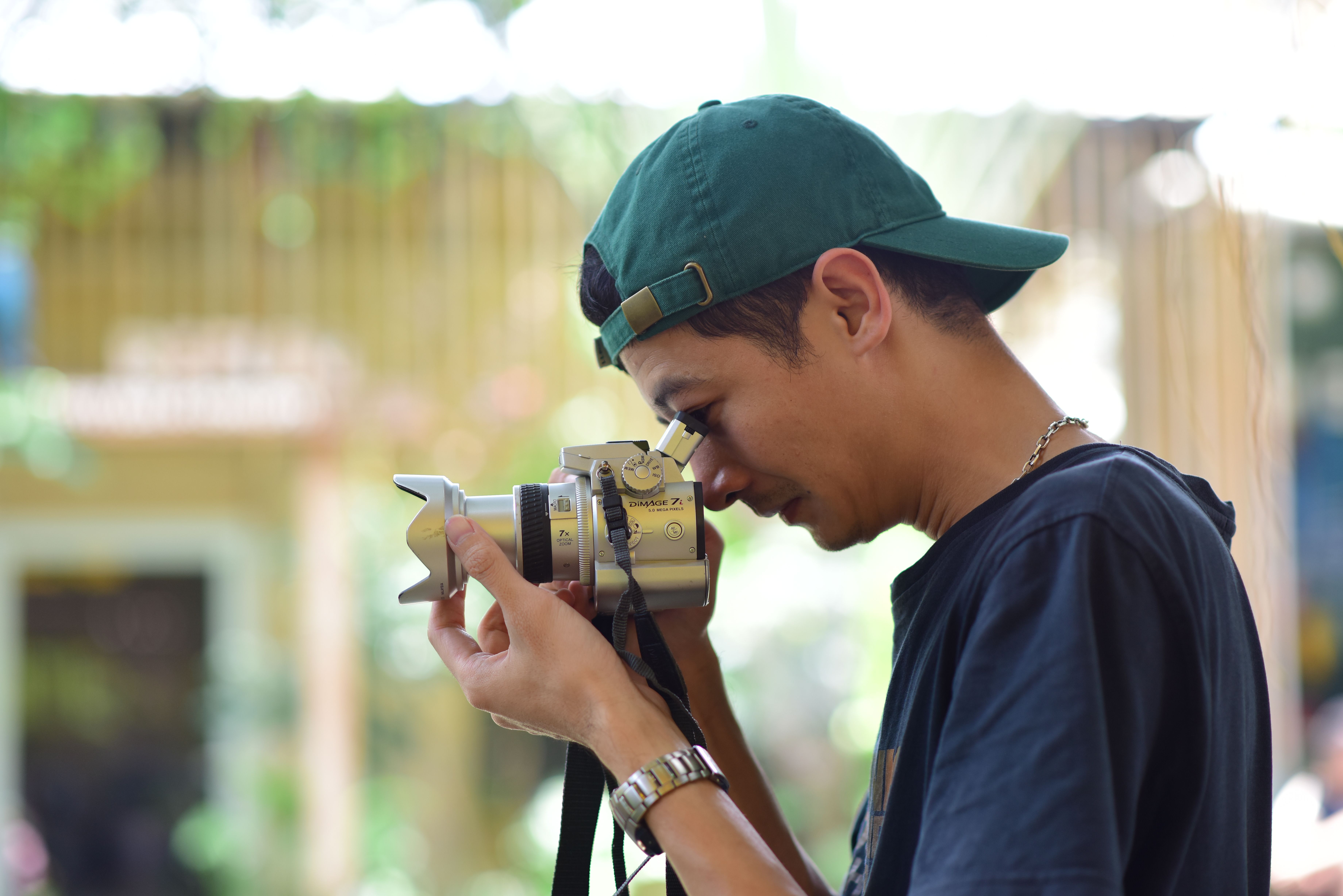Young Photographer Capturing the Scene Outdoors · Free Stock Photo