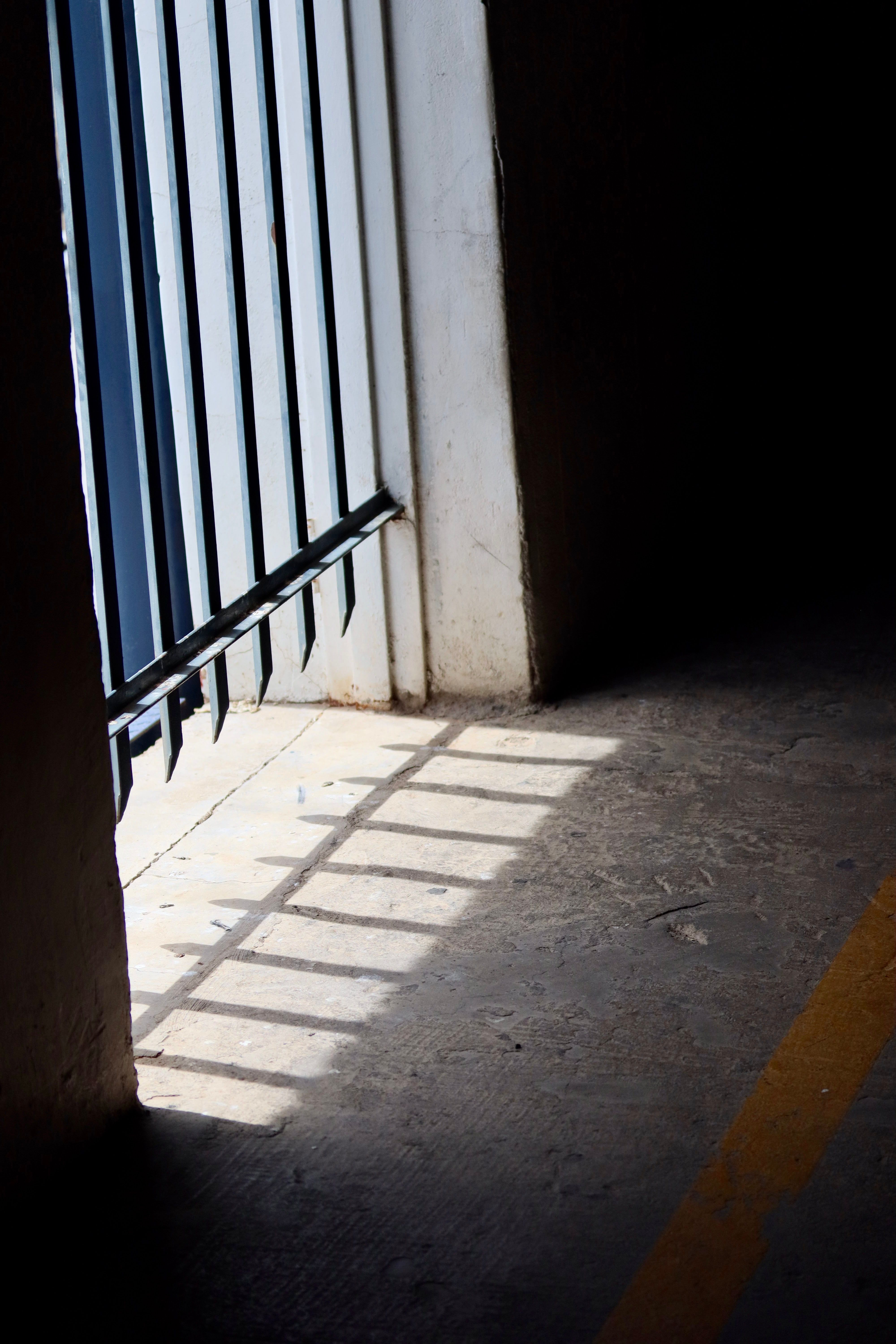 Sunlight Casting Shadows Through Open Doorway · Free Stock Photo