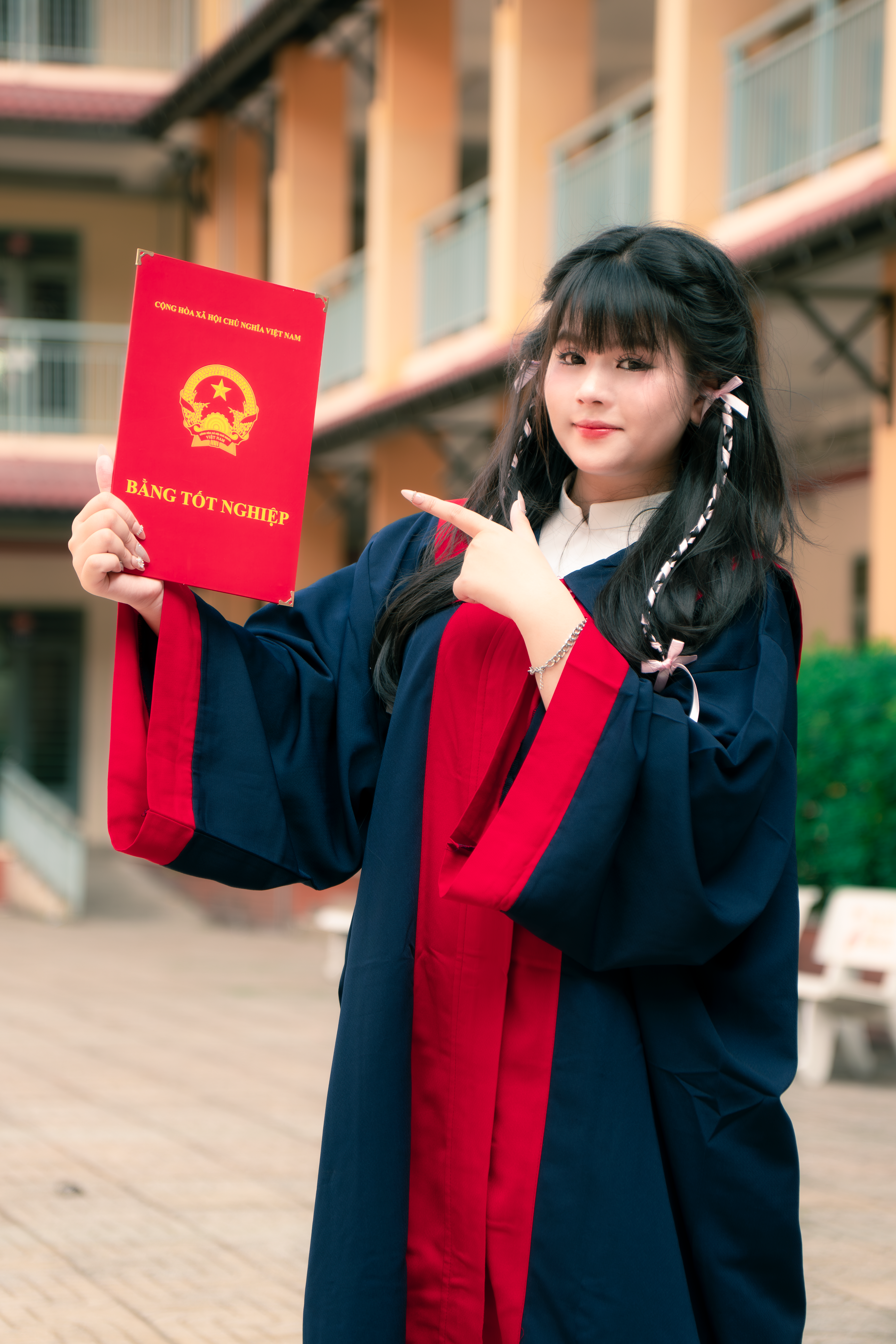 Young Woman Celebrating Graduation Outdoors · Free Stock Photo
