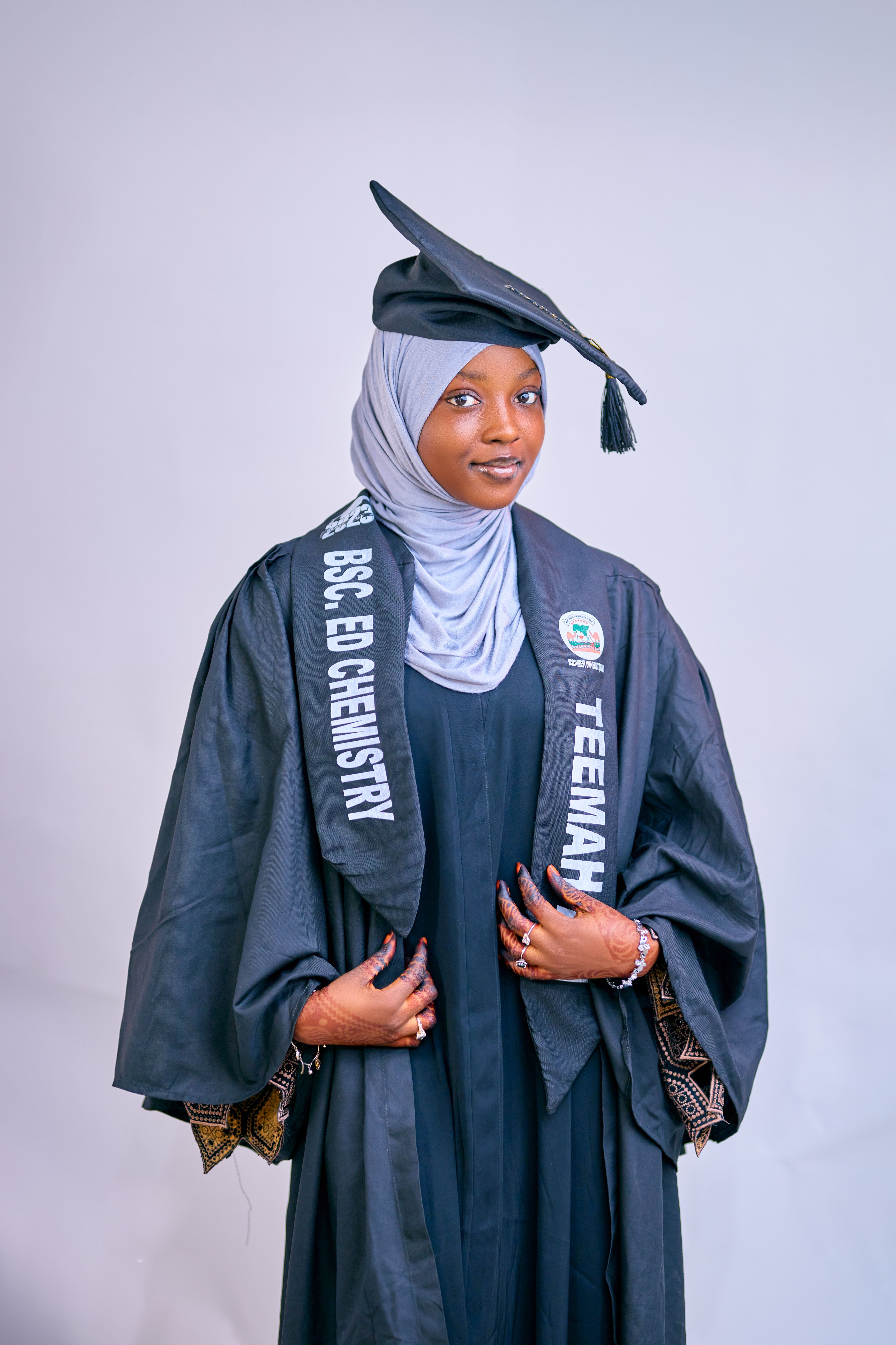 Young Female Graduate in Traditional Attire · Free Stock Photo