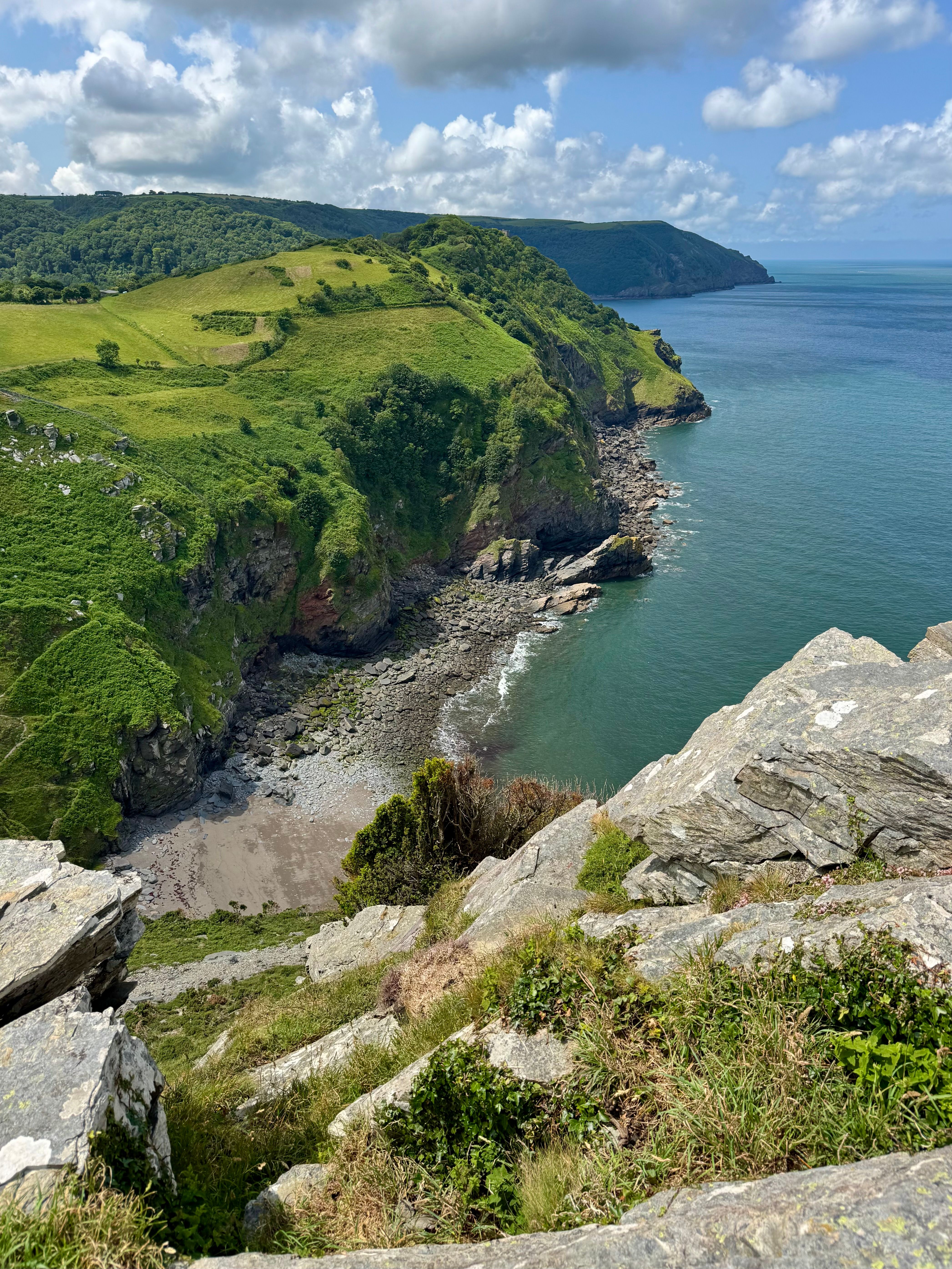 Scenic Coastal Cliff Overlooking Serene Bay · Free Stock Photo