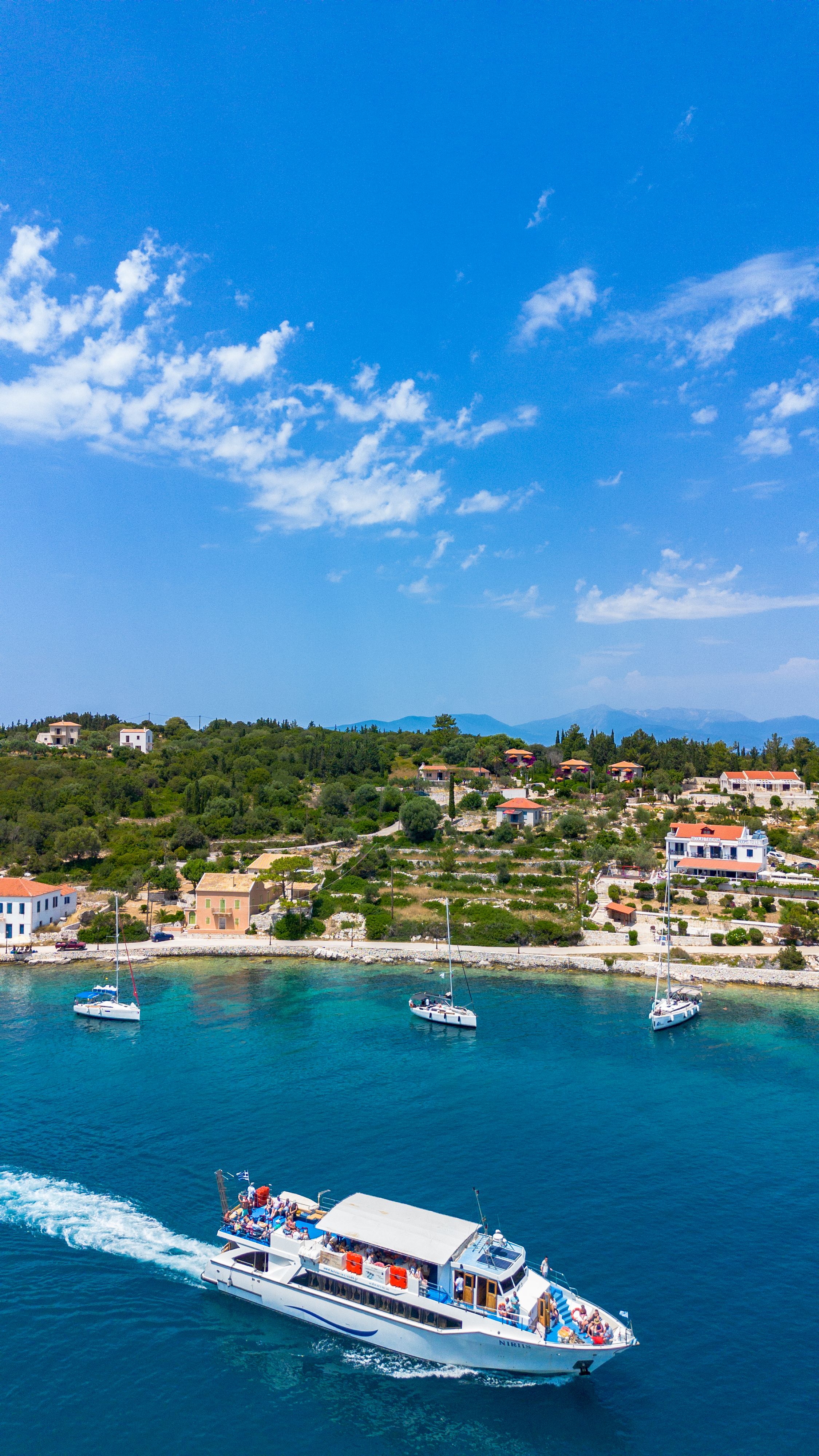 Scenic Coastal Boat Ride Along Mediterranean Shoreline · Free Stock Photo