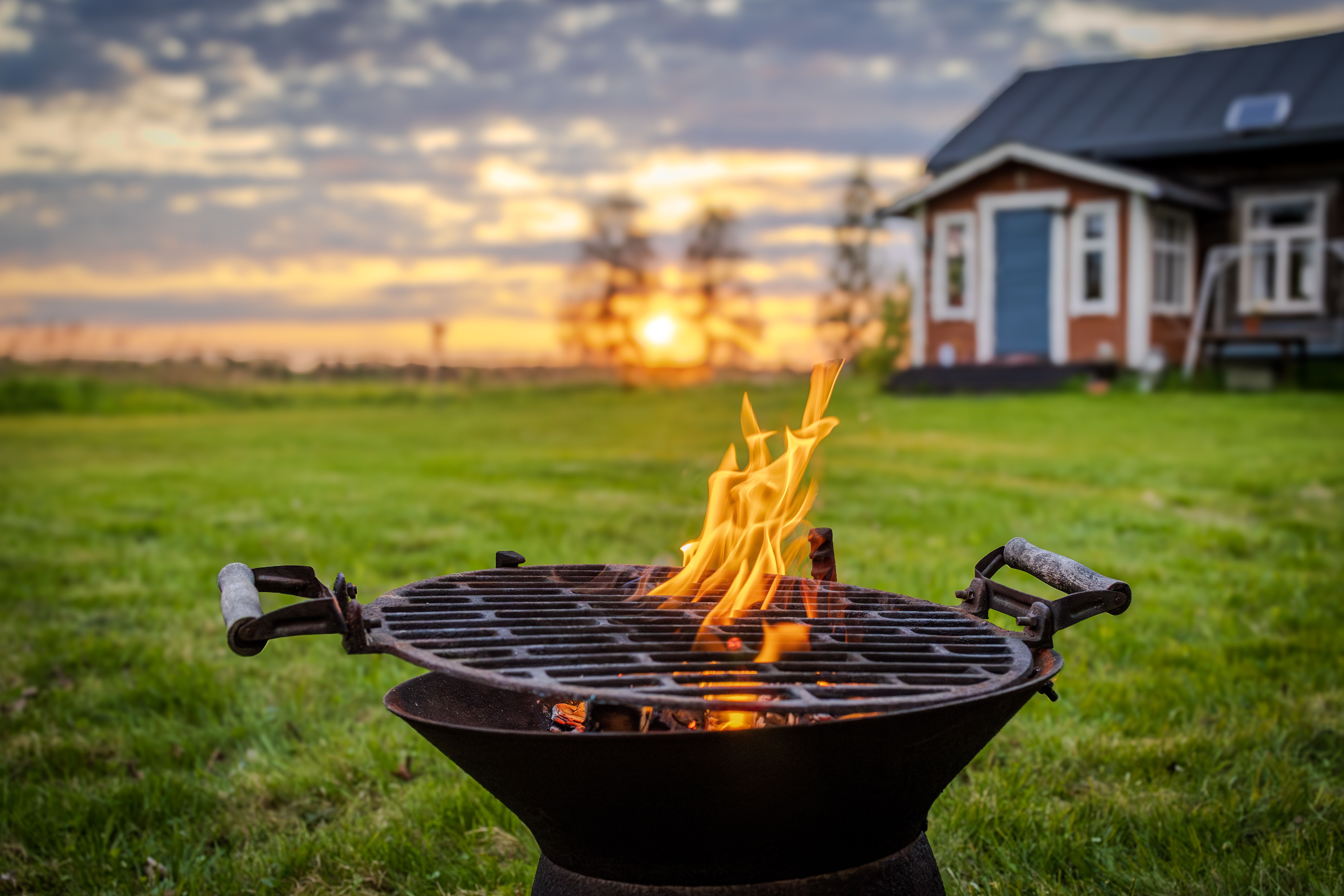 Cozy Campfire and Rustic Cabin at Sunset · Free Stock Photo