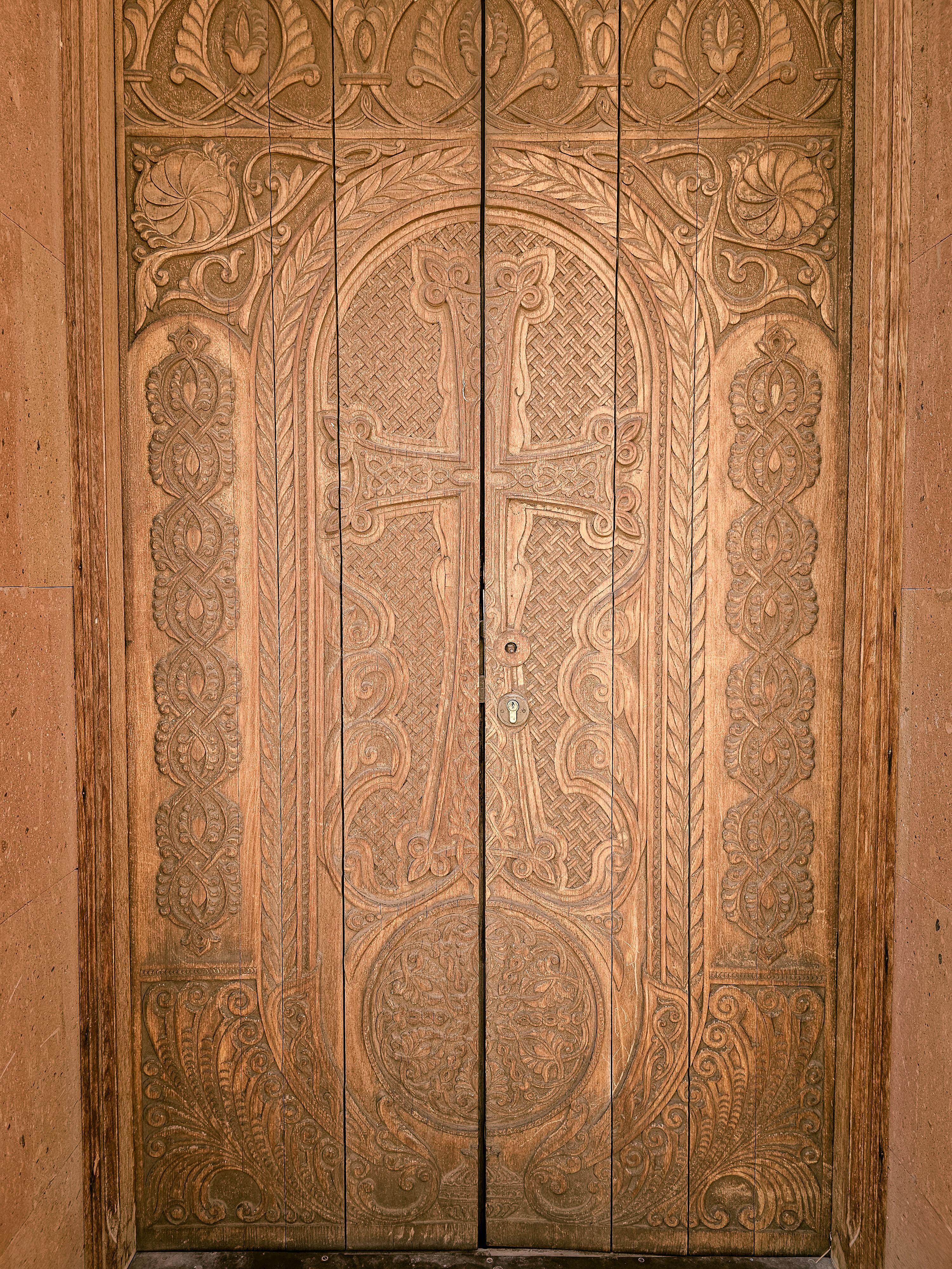 Ornately Carved Wooden Door with Cross Motif · Free Stock Photo
