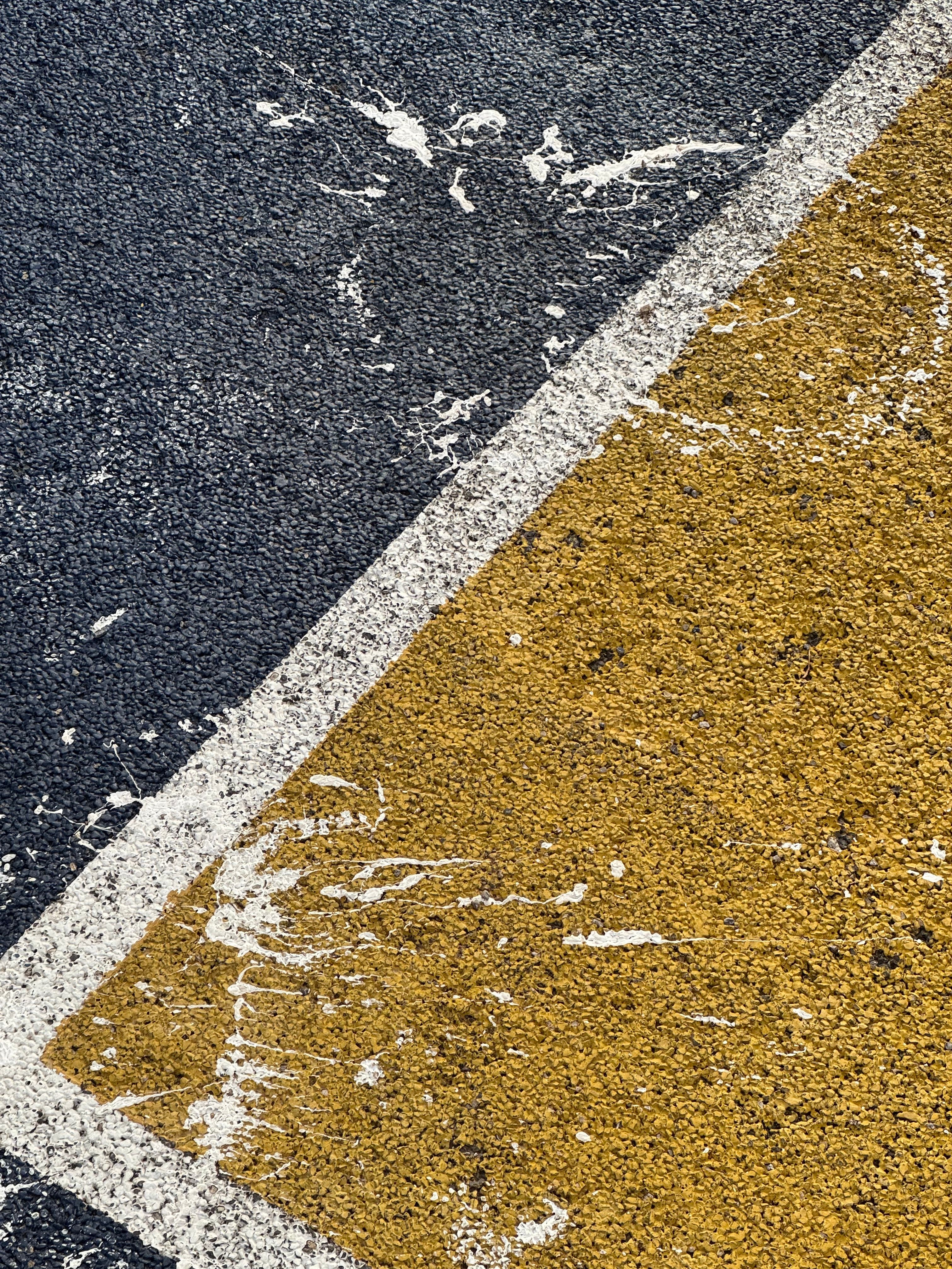 Texture of Asphalt with Yellow Paint Line · Free Stock Photo