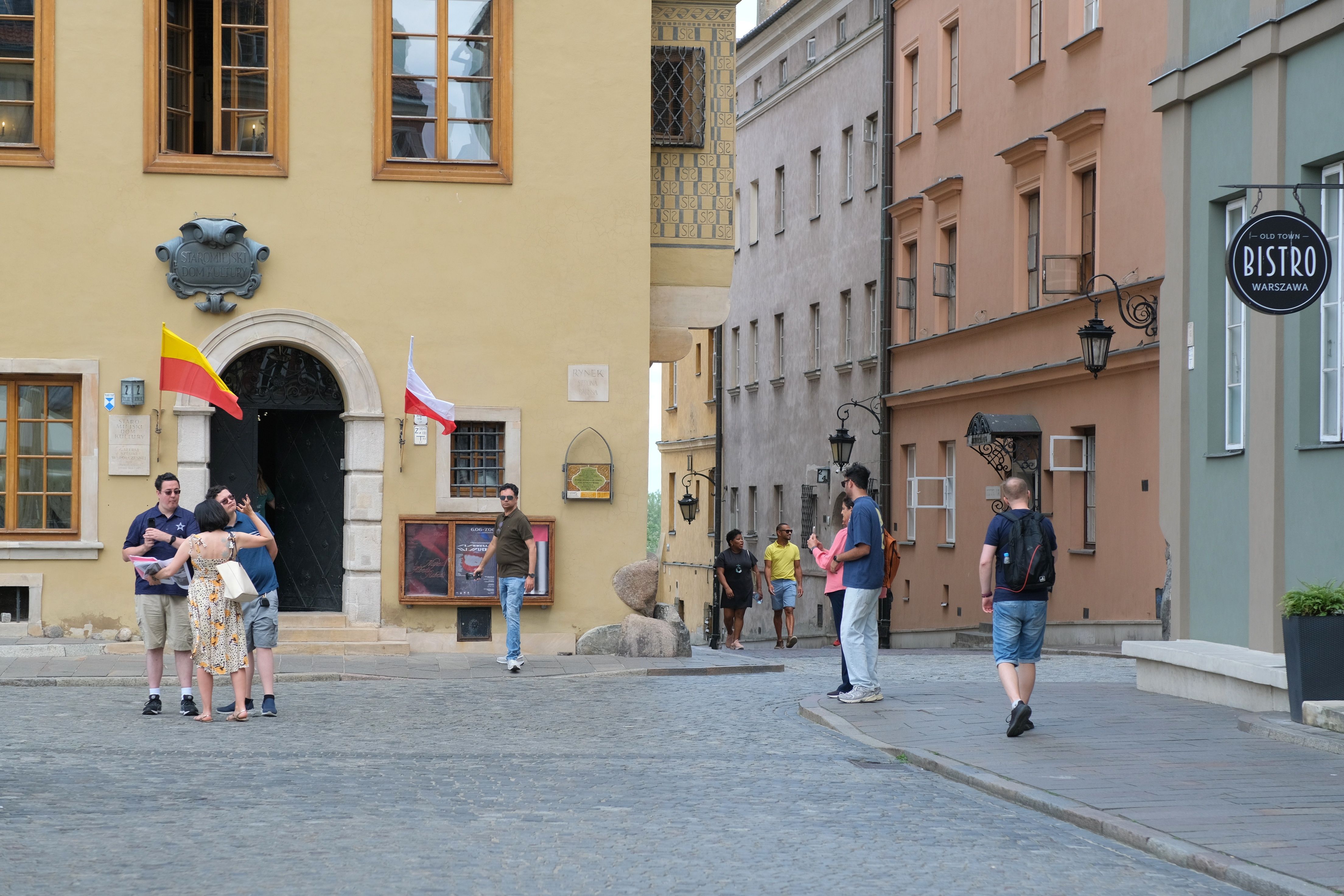 Tourists Exploring Old Town Warsaw Streets · Free Stock Photo