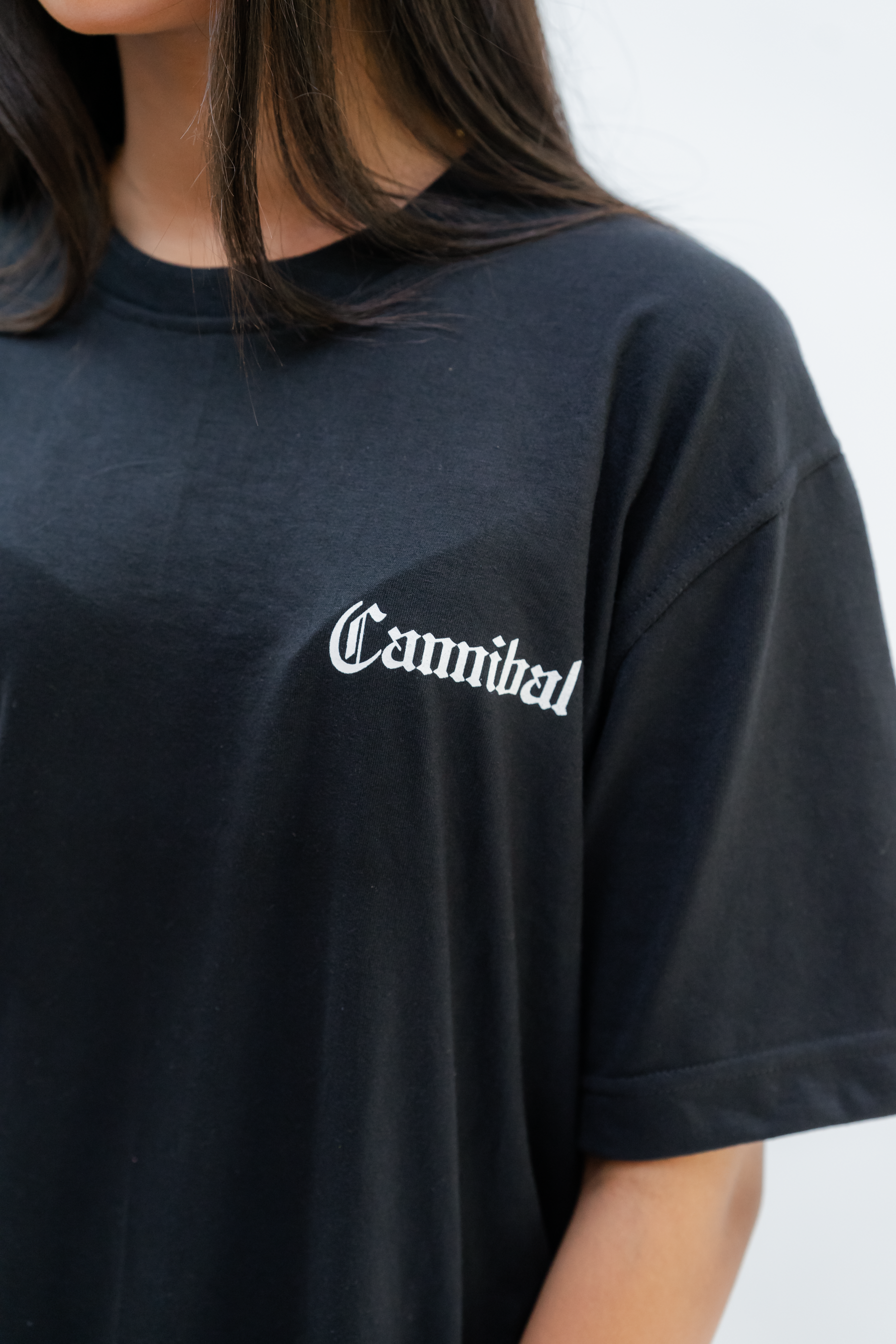 Close-Up Black T-Shirt with 'Cannibal' Text · Free Stock Photo