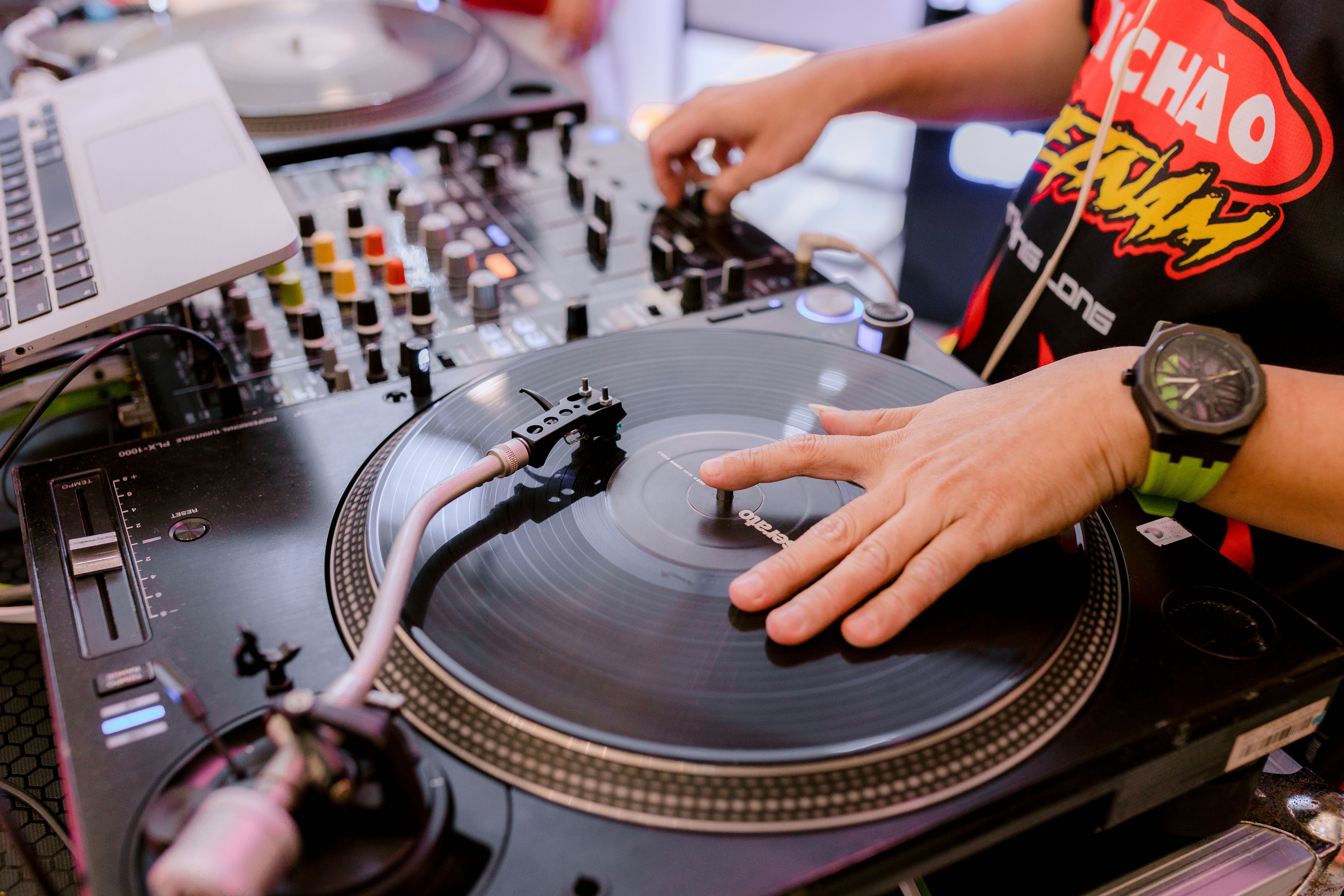 DJ Spinning Vinyl at a Music Event · Free Stock Photo
