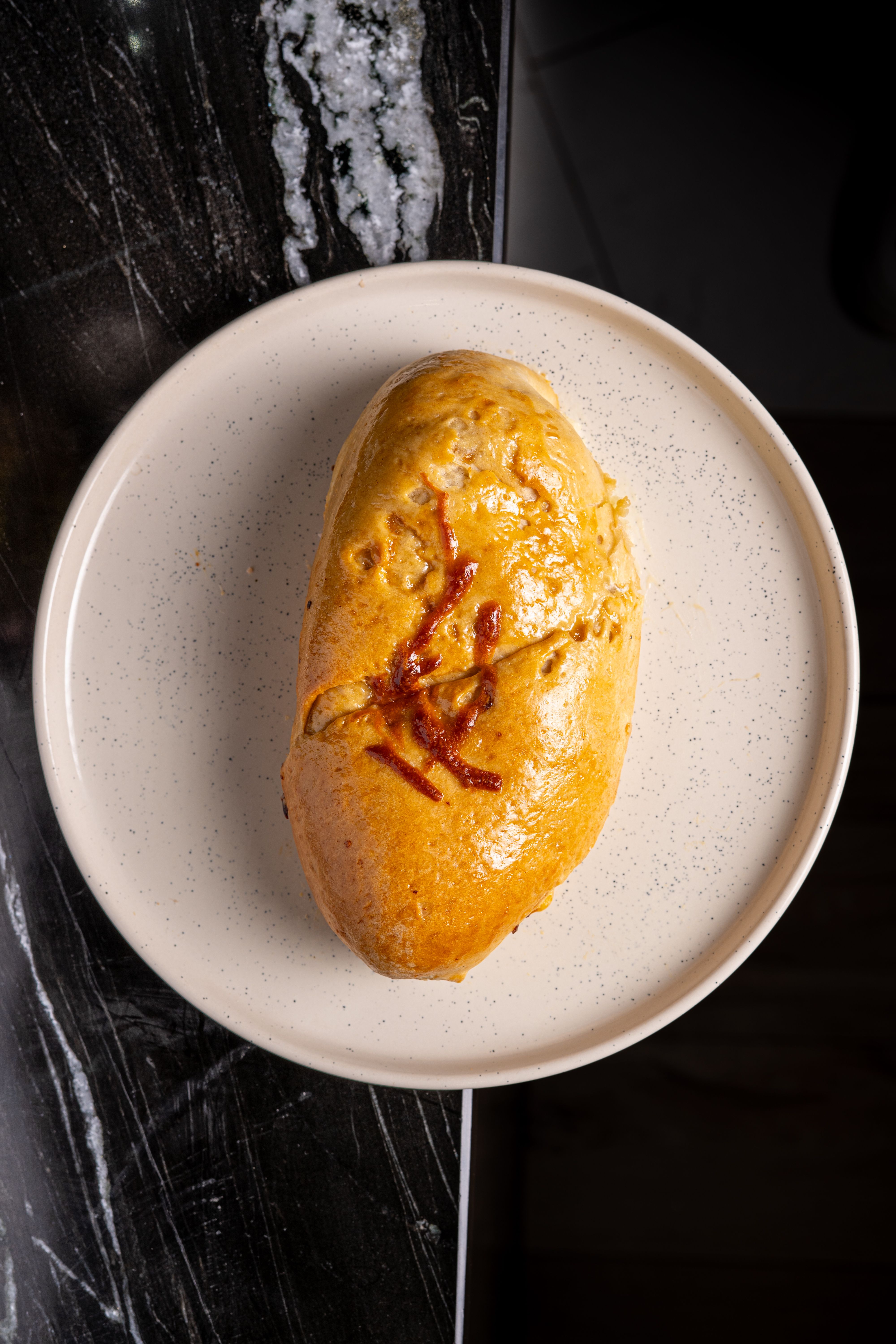 Top View of Freshly Baked Oval Bread Roll · Free Stock Photo