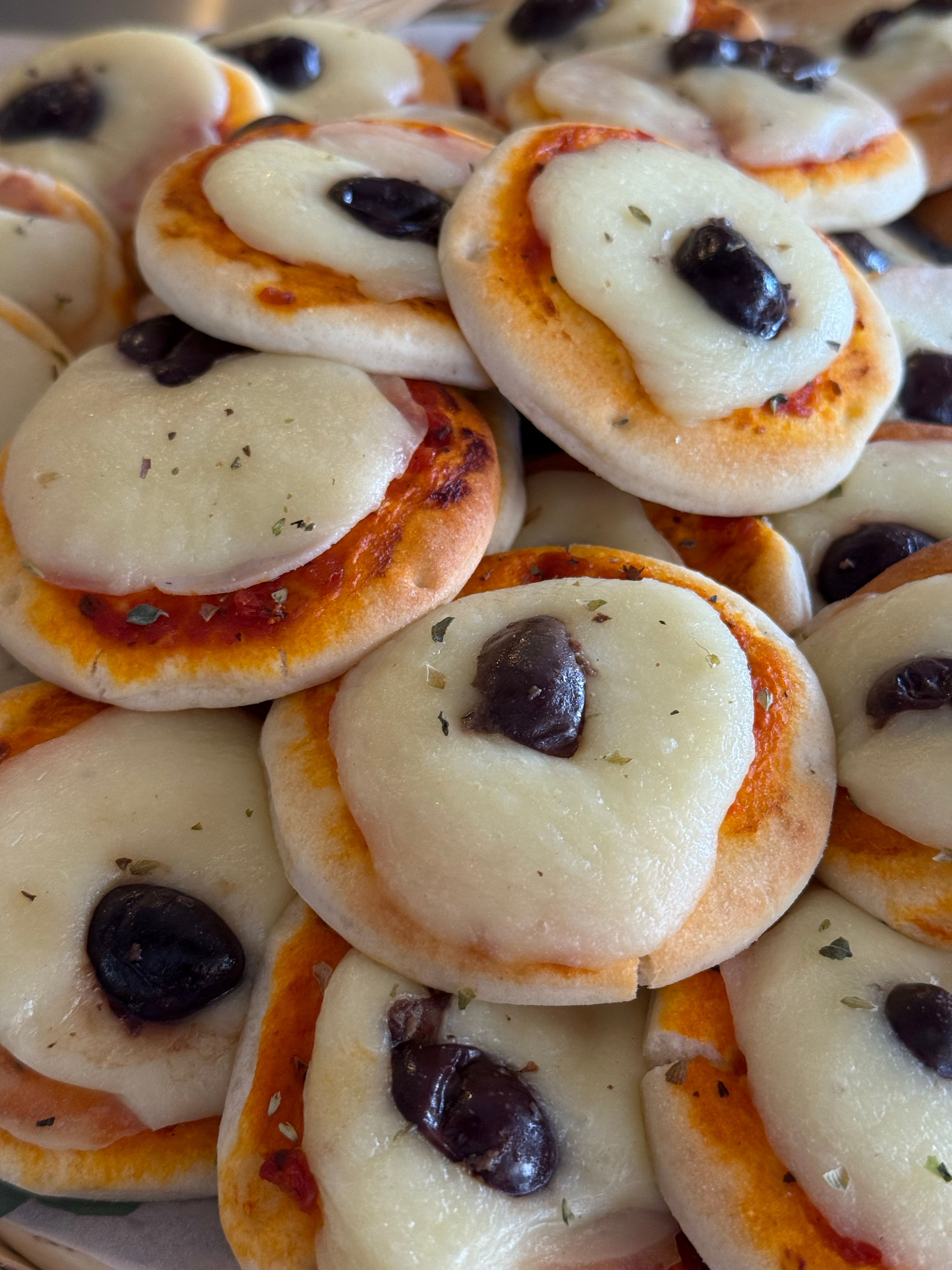 Delicious Mini Pizzas with Black Olives Topping · Free Stock Photo