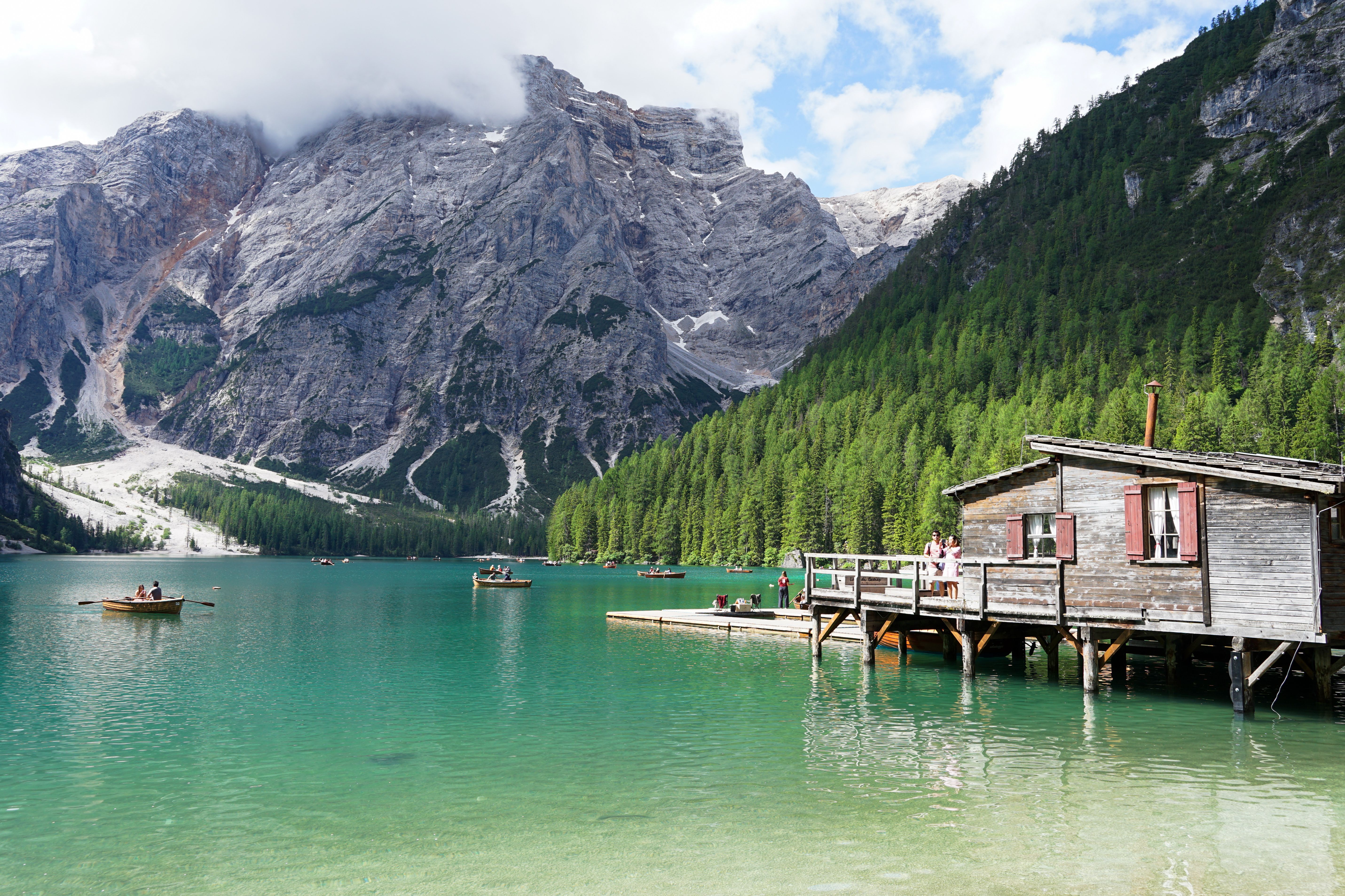 Idyllic Lake Scene with Mountains and Cabin · Free Stock Photo