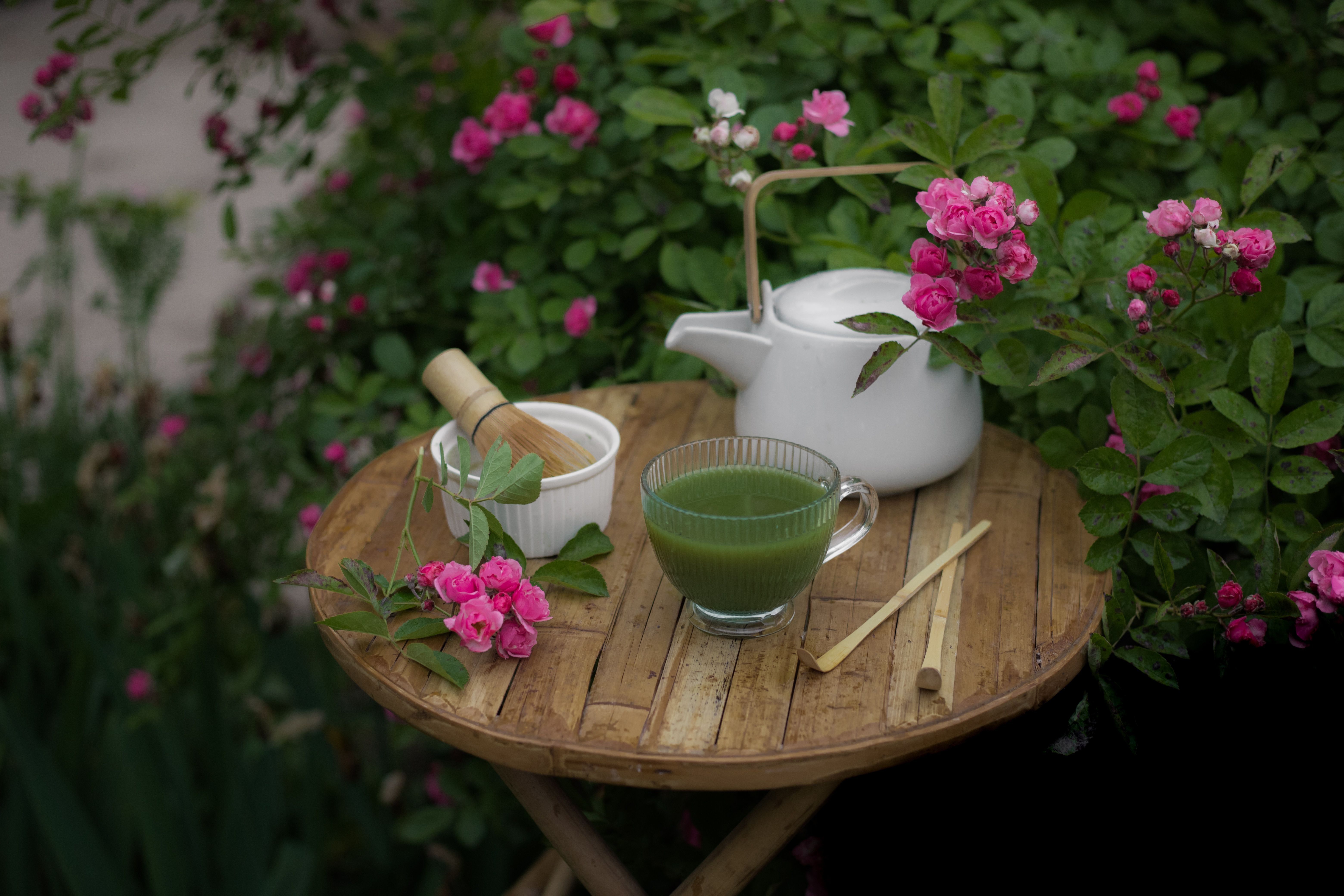 Serene Garden Tea Setting with Matcha and Roses · Free Stock Photo
