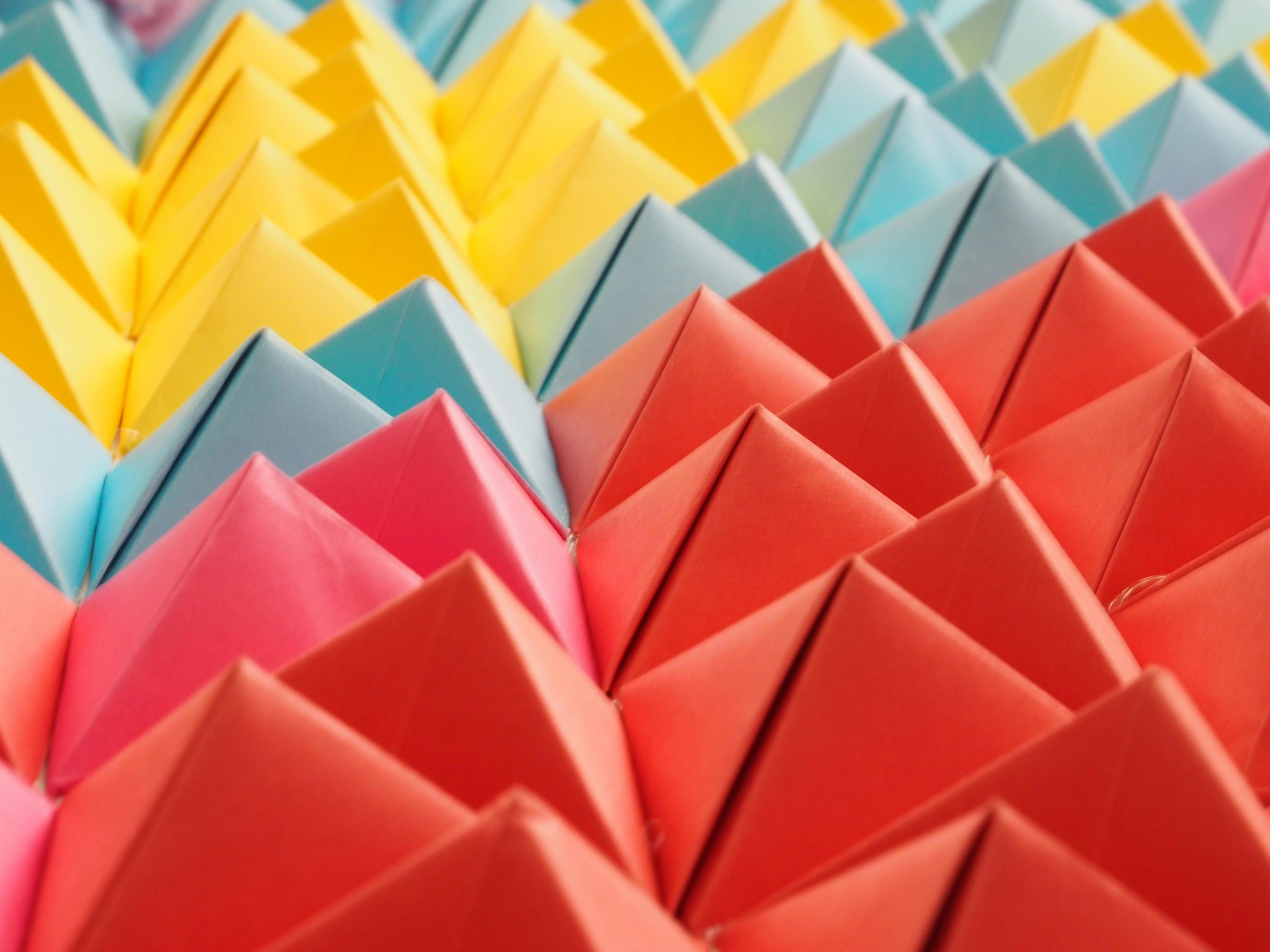 Colorful Origami Pyramids in Patterned Arrangement · Free Stock Photo