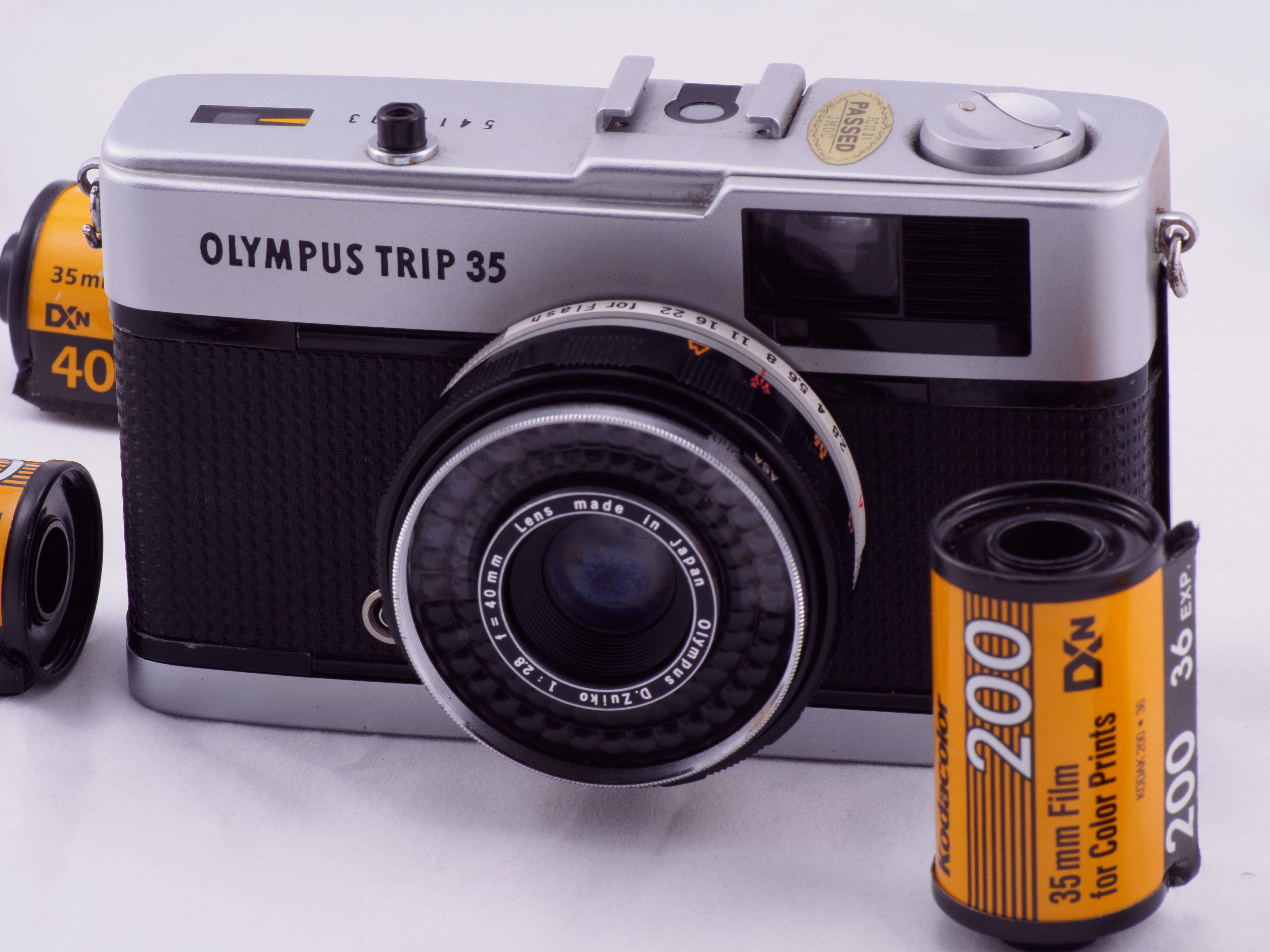 Vintage Olympus Trip 35 Camera with Film Rolls · Free Stock Photo
