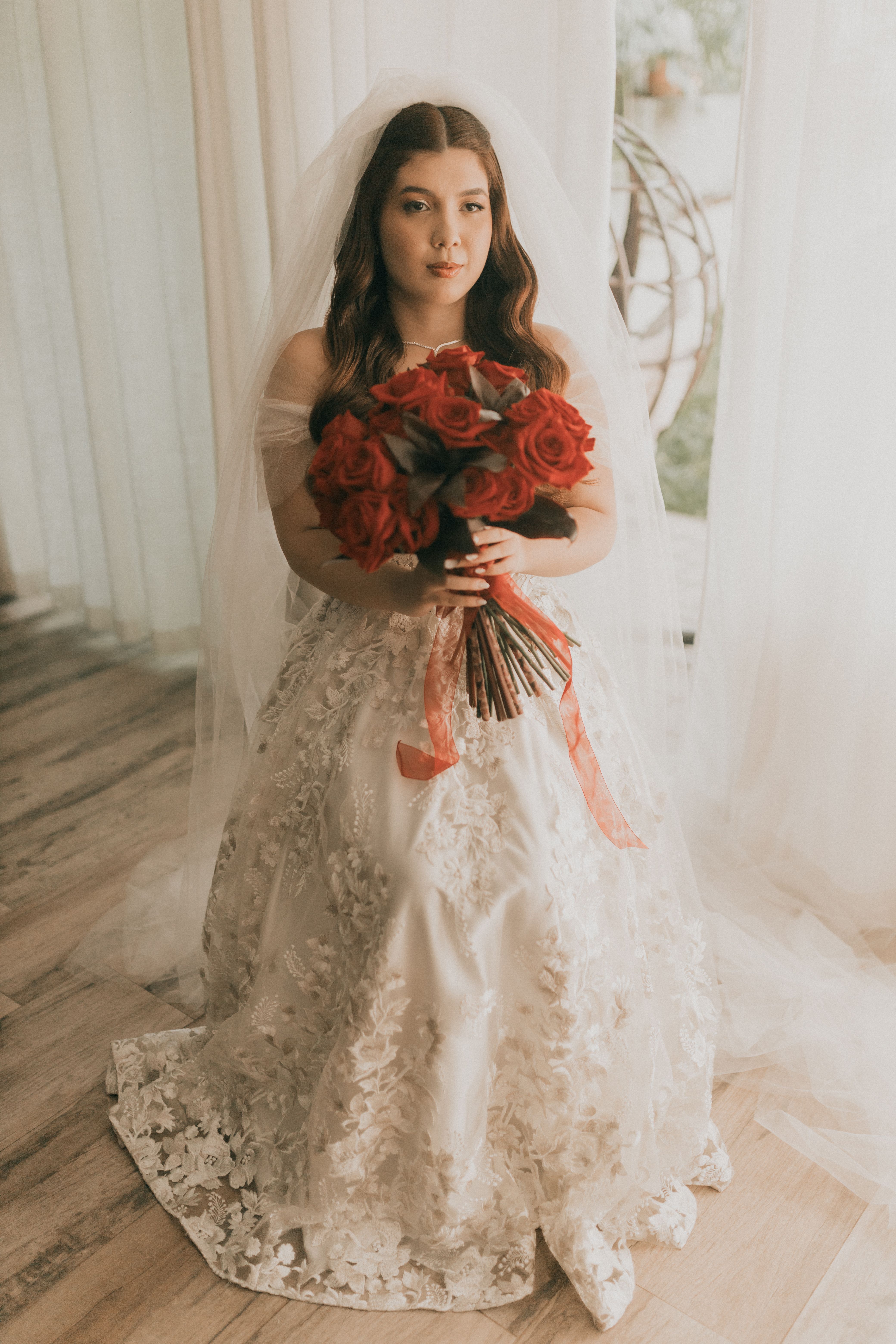 Beautiful Bride Holding Red Rose Bouquet · Free Stock Photo