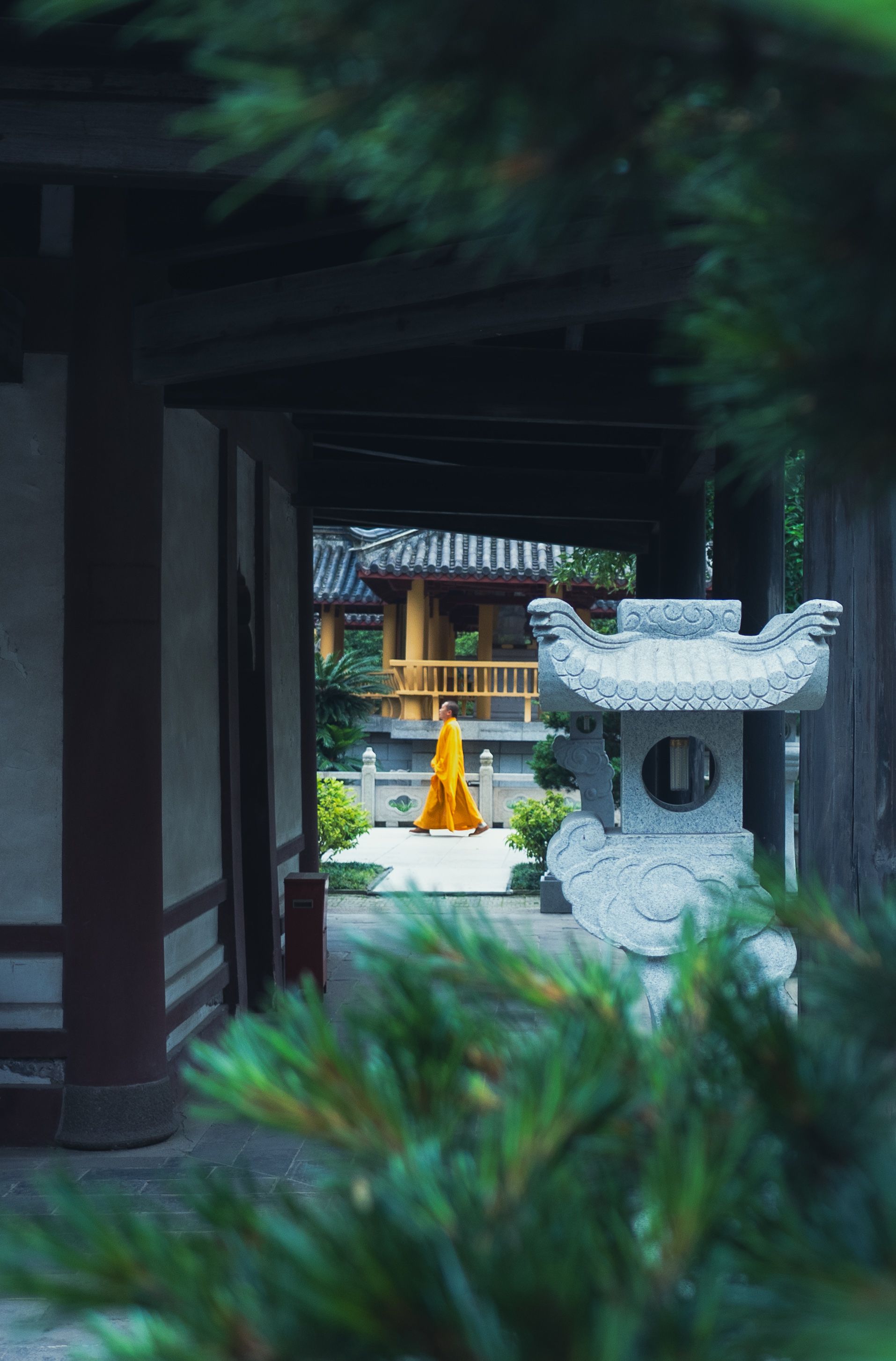 Tranquil Temple Courtyard with Monk in Yellow Robe · Free Stock Photo