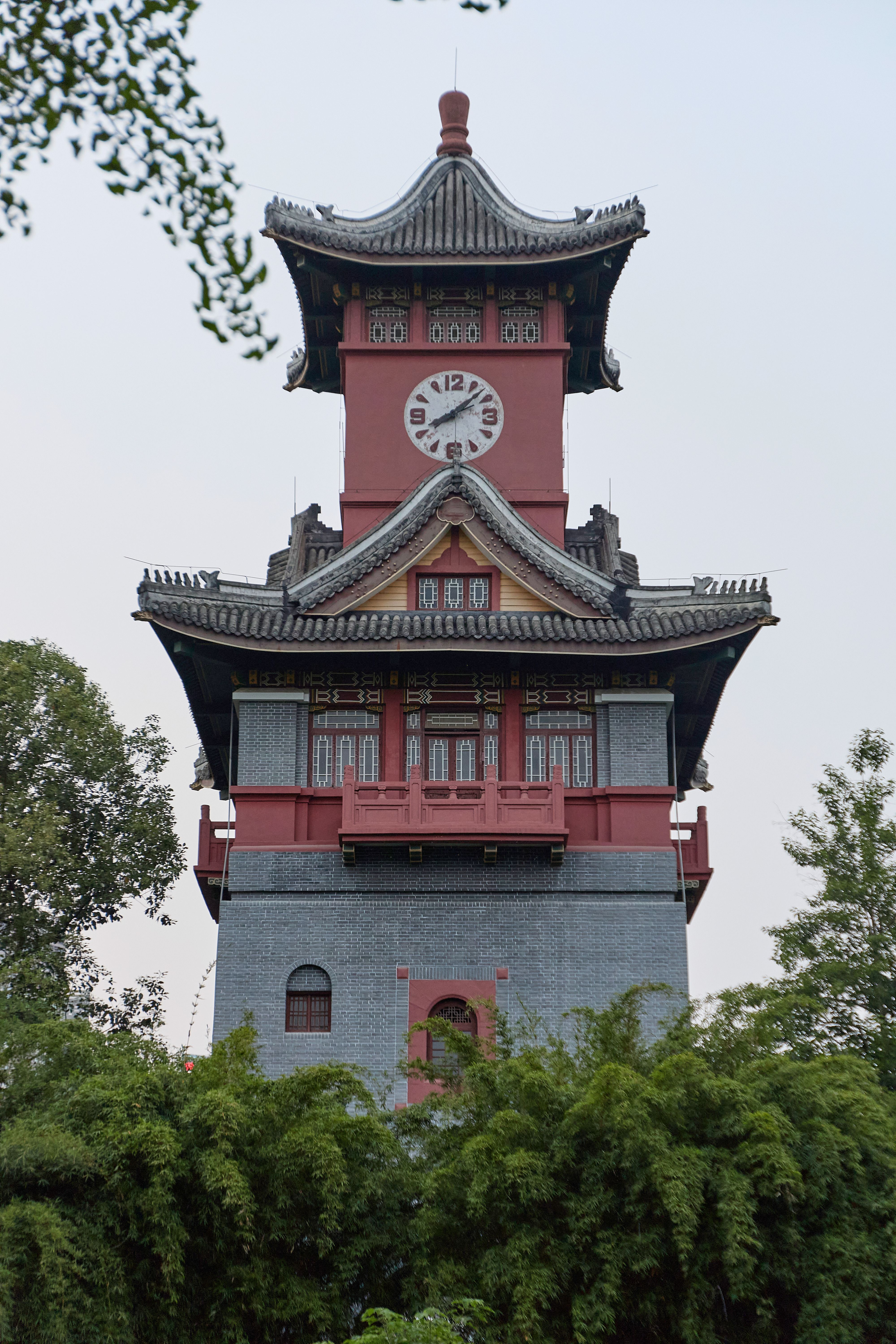 Traditional Chinese Clock Tower Amidst Greenery · Free Stock Photo