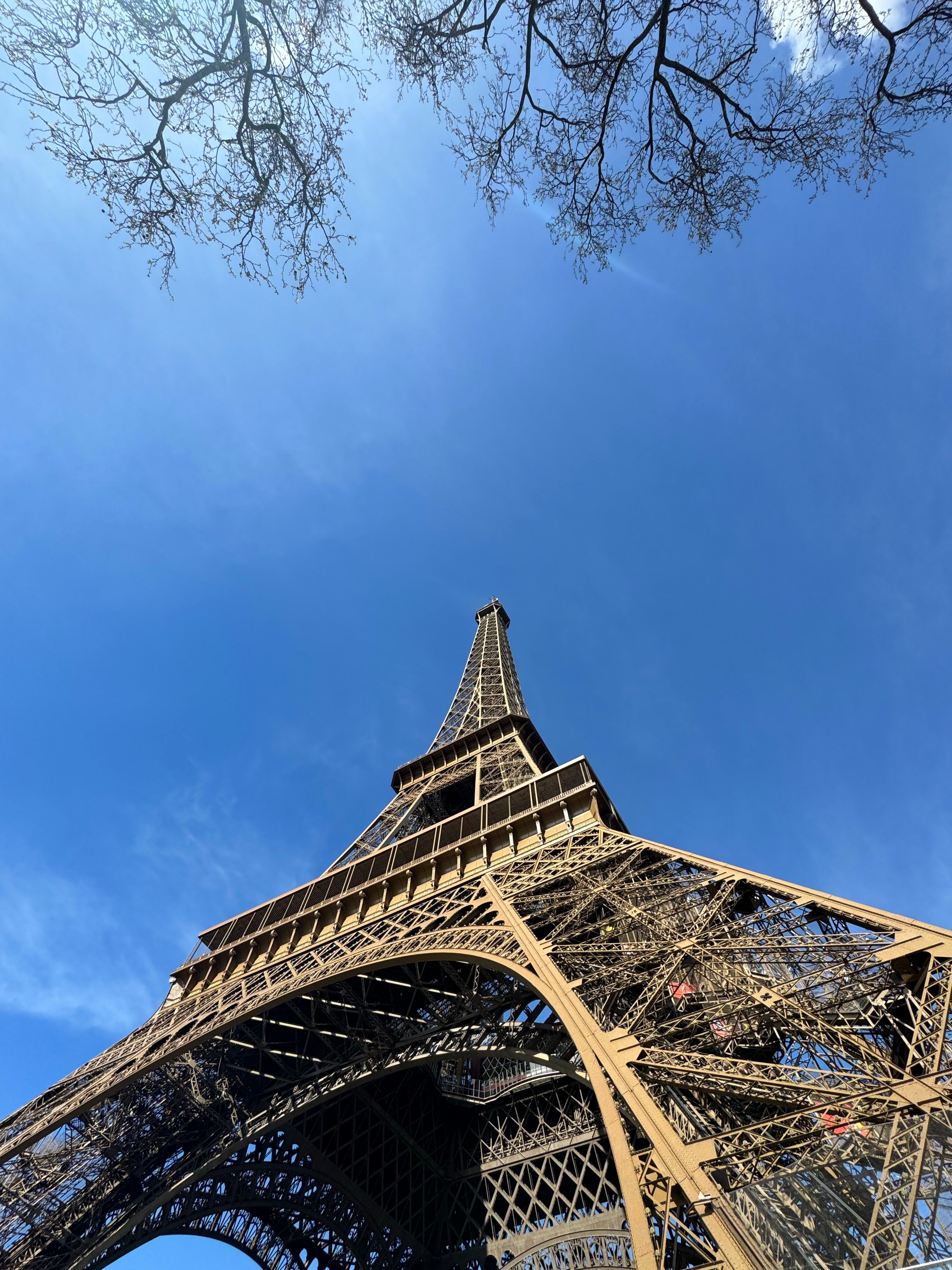 Eiffel Tower against a Clear Blue Sky in Paris · Free Stock Photo