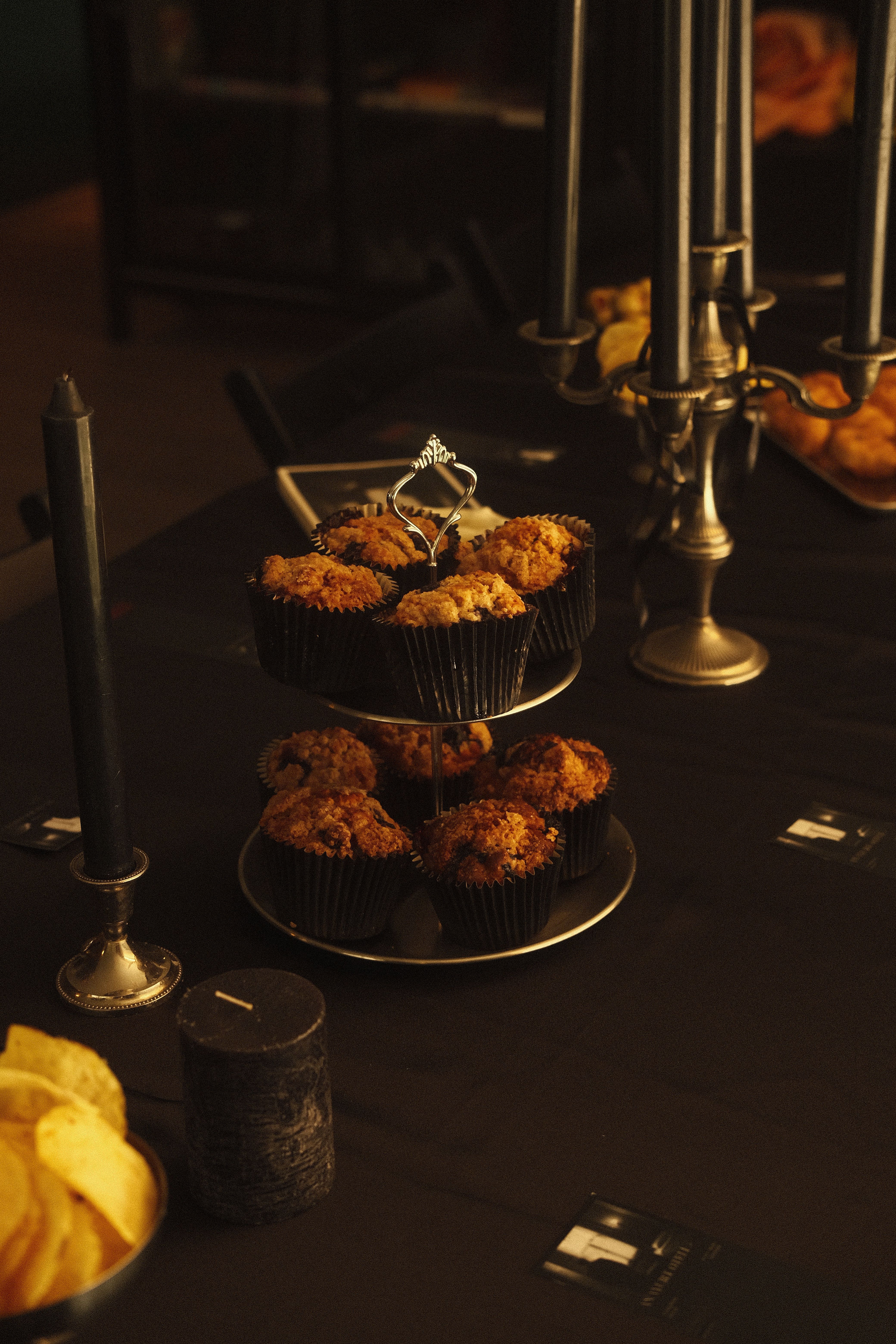 Elegant Dark Themed Table Setting with Muffins · Free Stock Photo