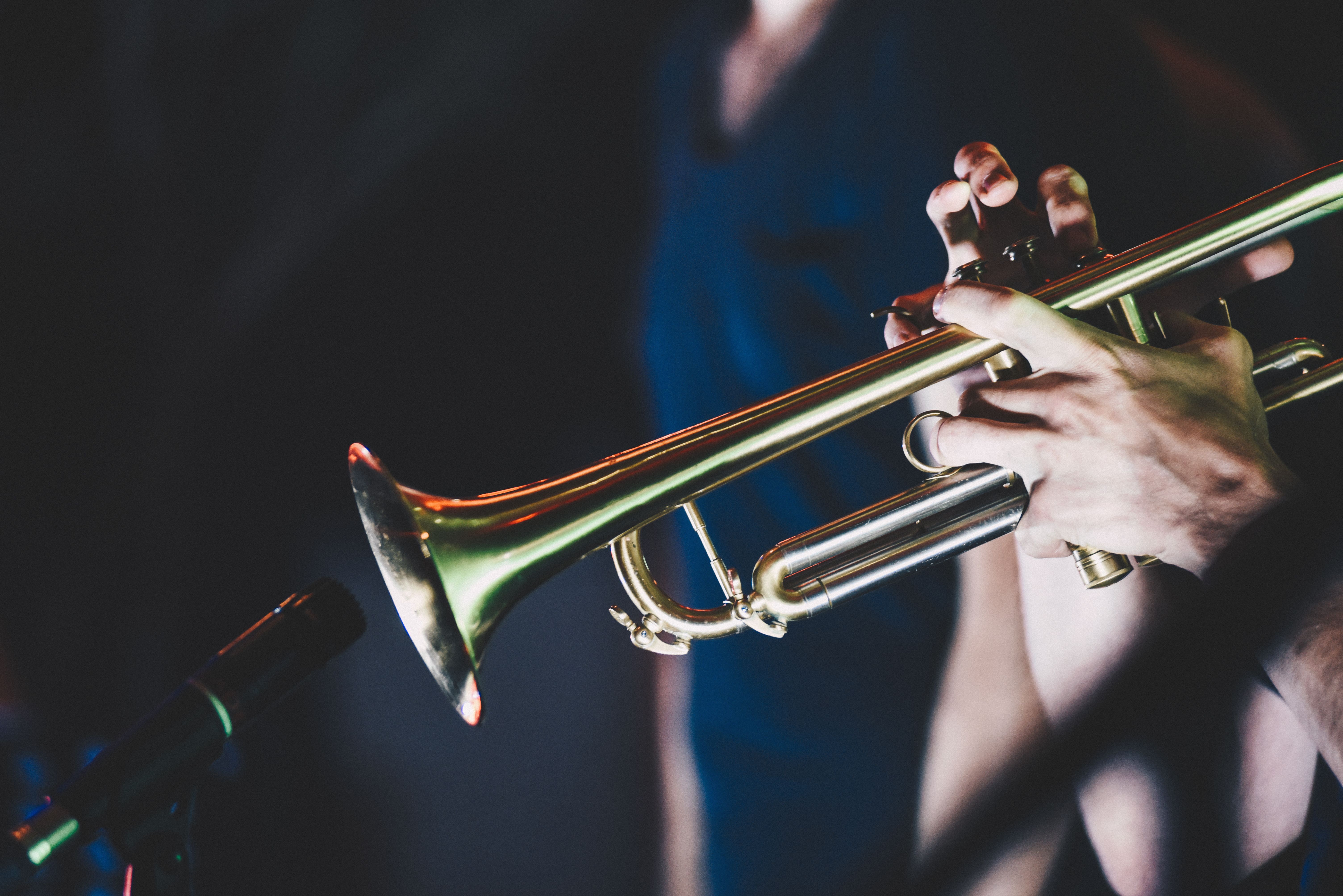 Close-up of trumpet player performing on stage · Free Stock Photo