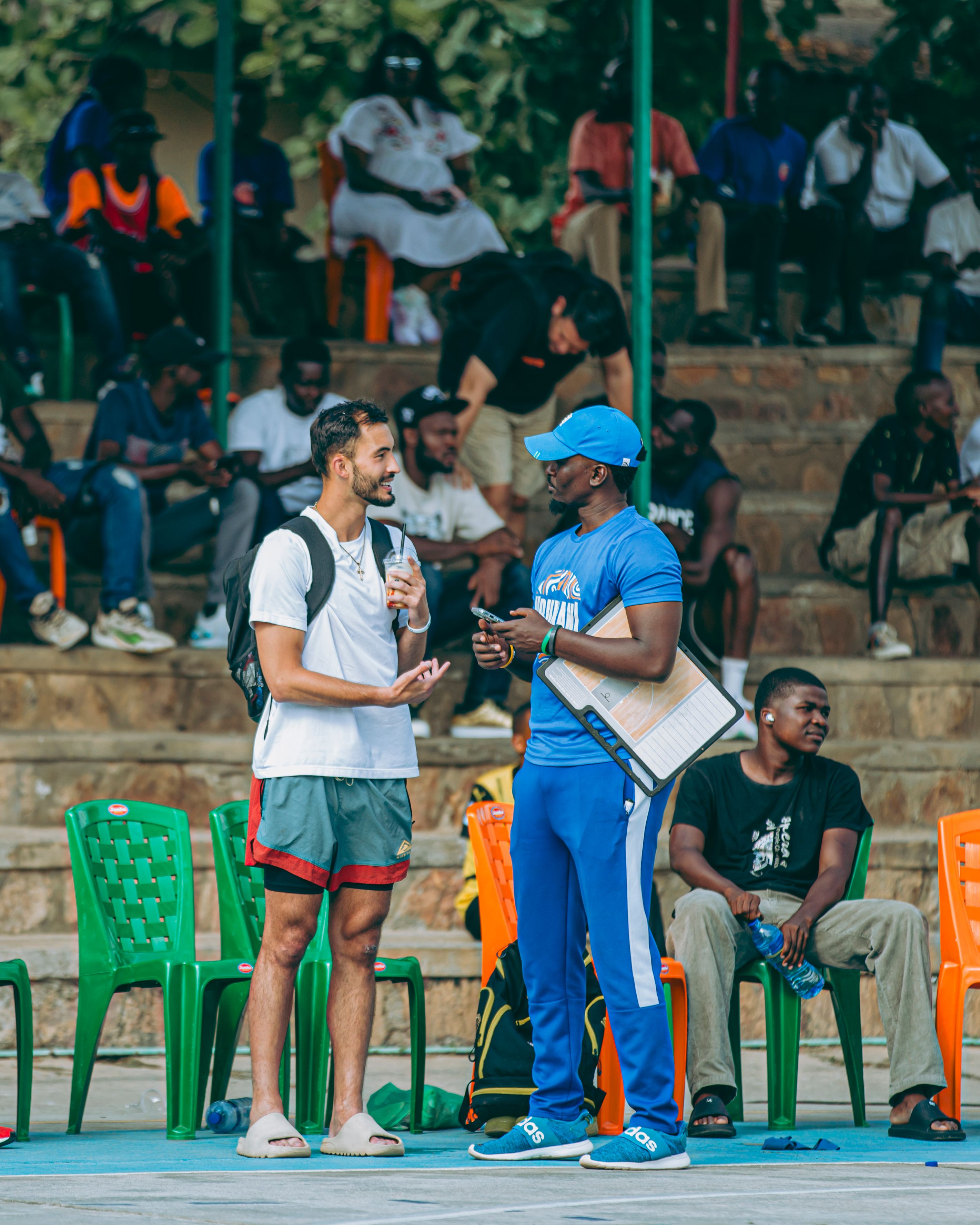 Casual Outdoor Conversation at Sports Event · Free Stock Photo