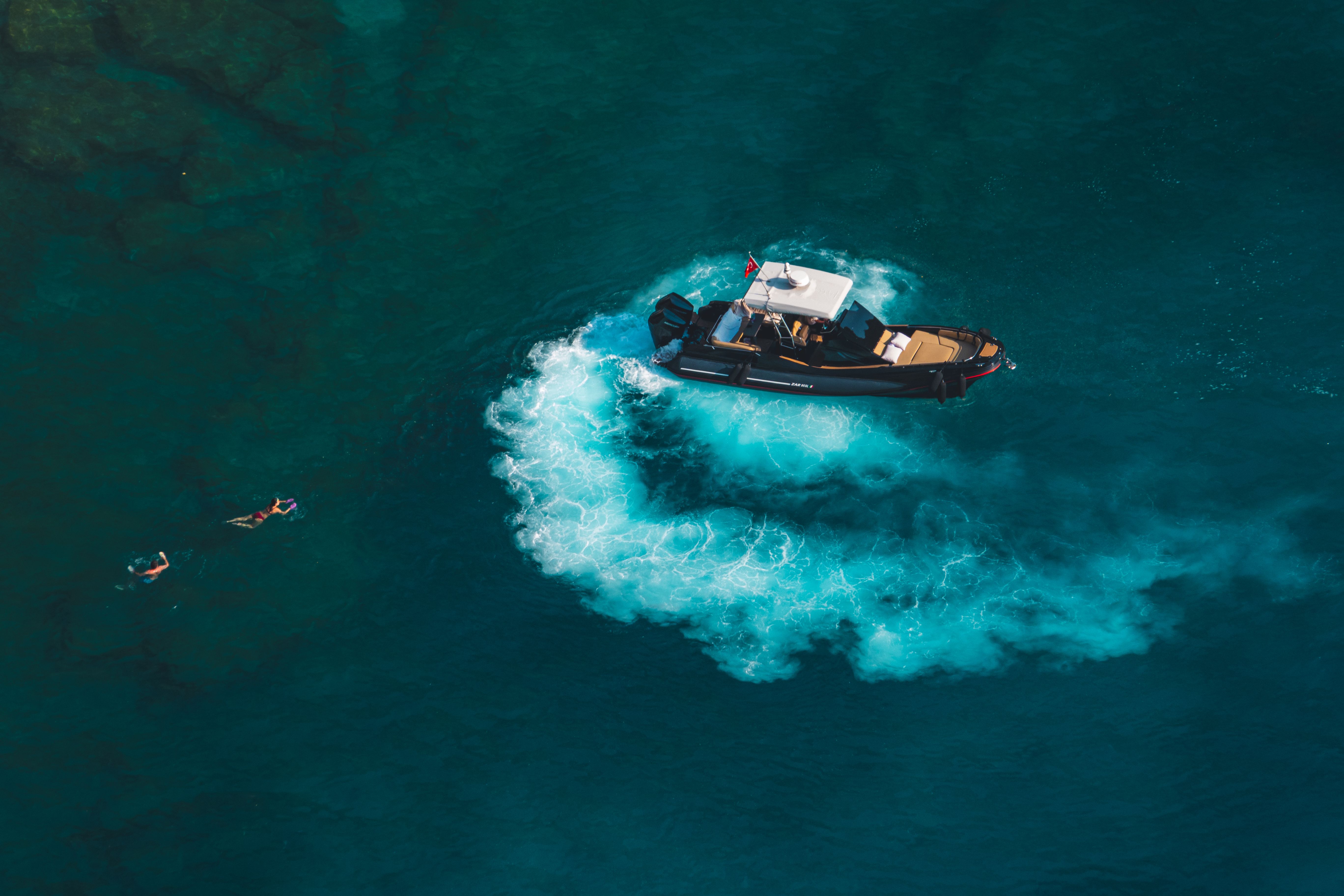 Top View Photo of Boat on Ocean · Free Stock Photo