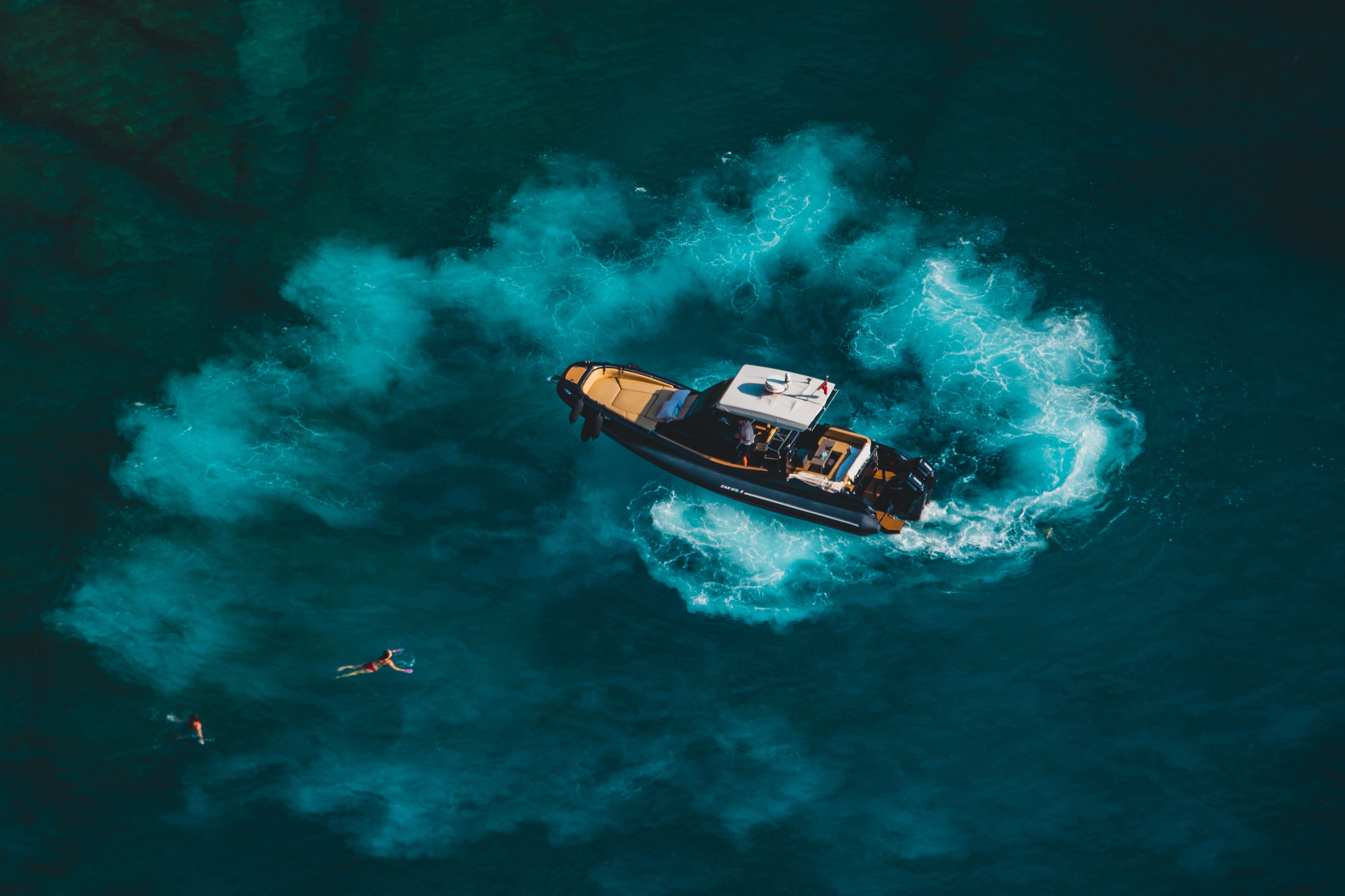 Top View Photo of Boat on Ocean · Free Stock Photo