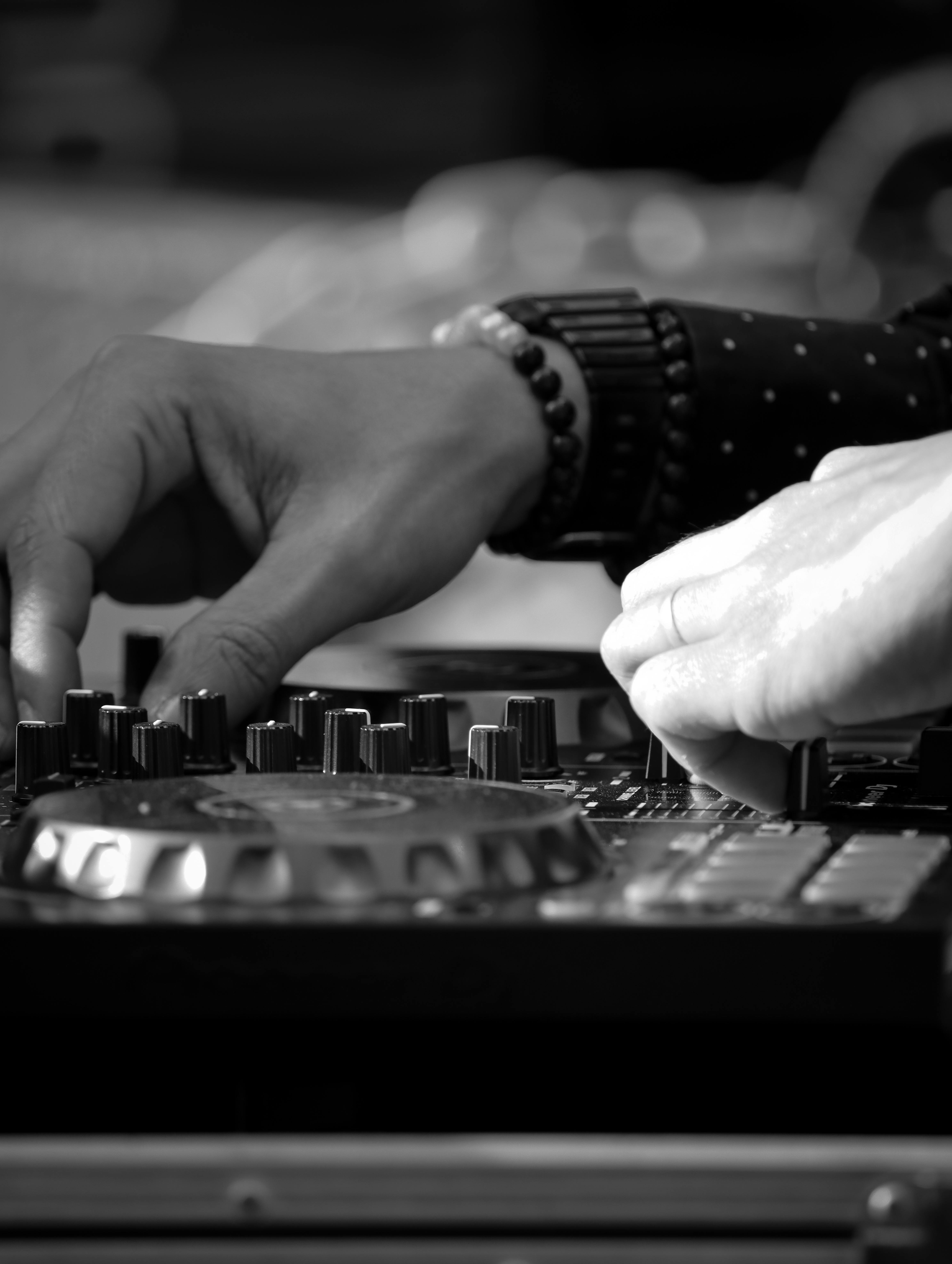Grayscale Photography of Person Using Dj Controller · Free Stock Photo