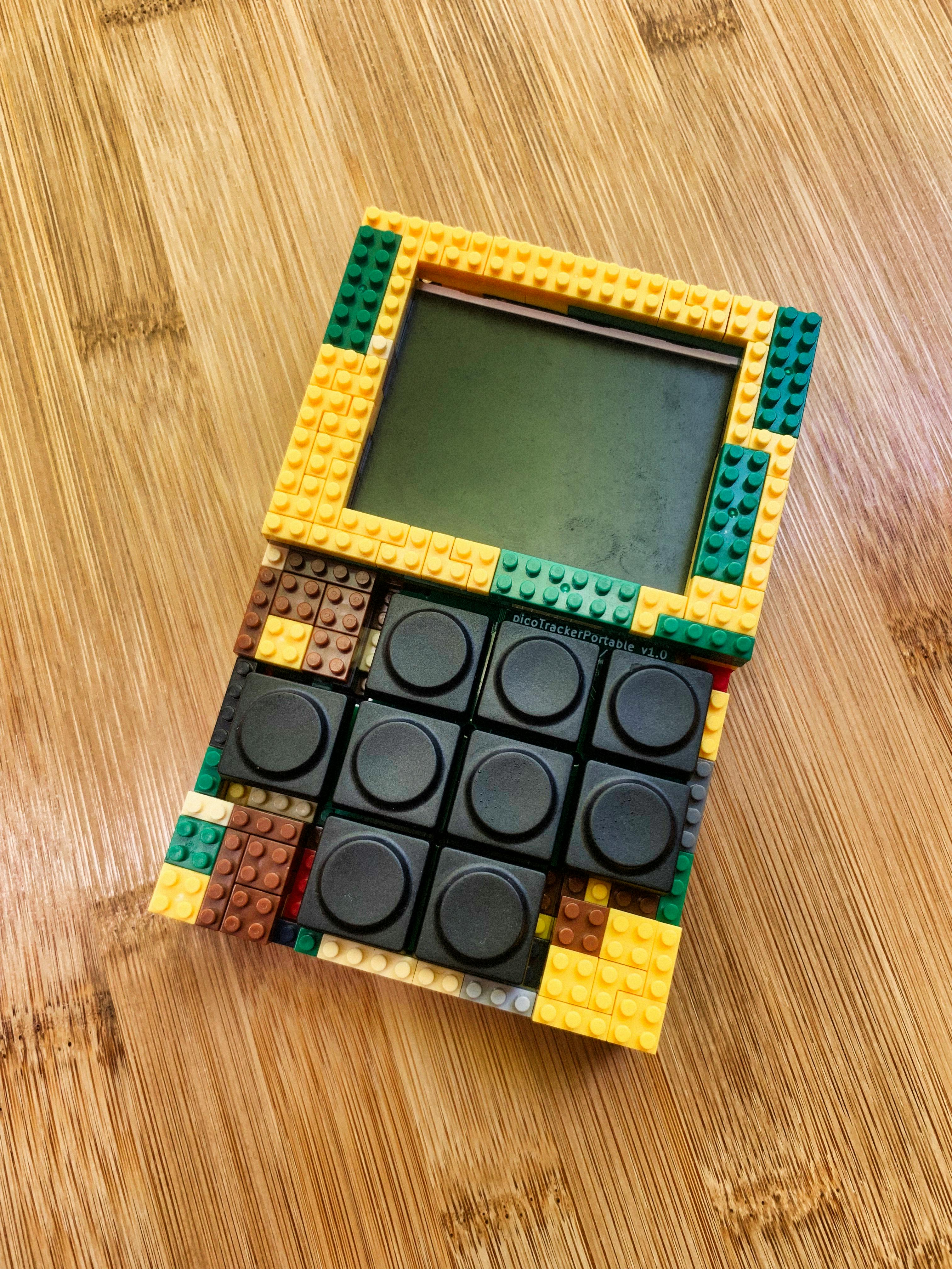 Colorful LEGO Calculator on Wooden Surface · Free Stock Photo